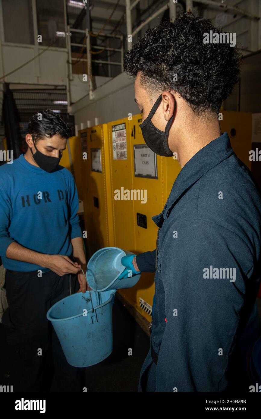 PACIFIC OCEAN (Feb. 26, 2021) – U.S. Navy Aviation Ordnanceman Airman ...