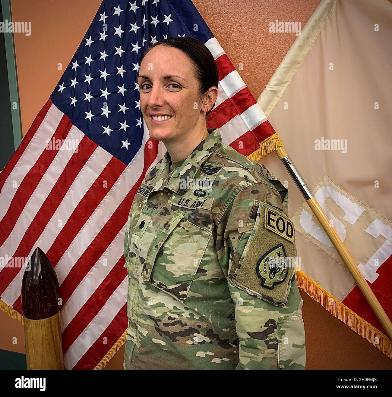 Lt. Col. Ashley Philibin stands in front of the United States Flag at ...