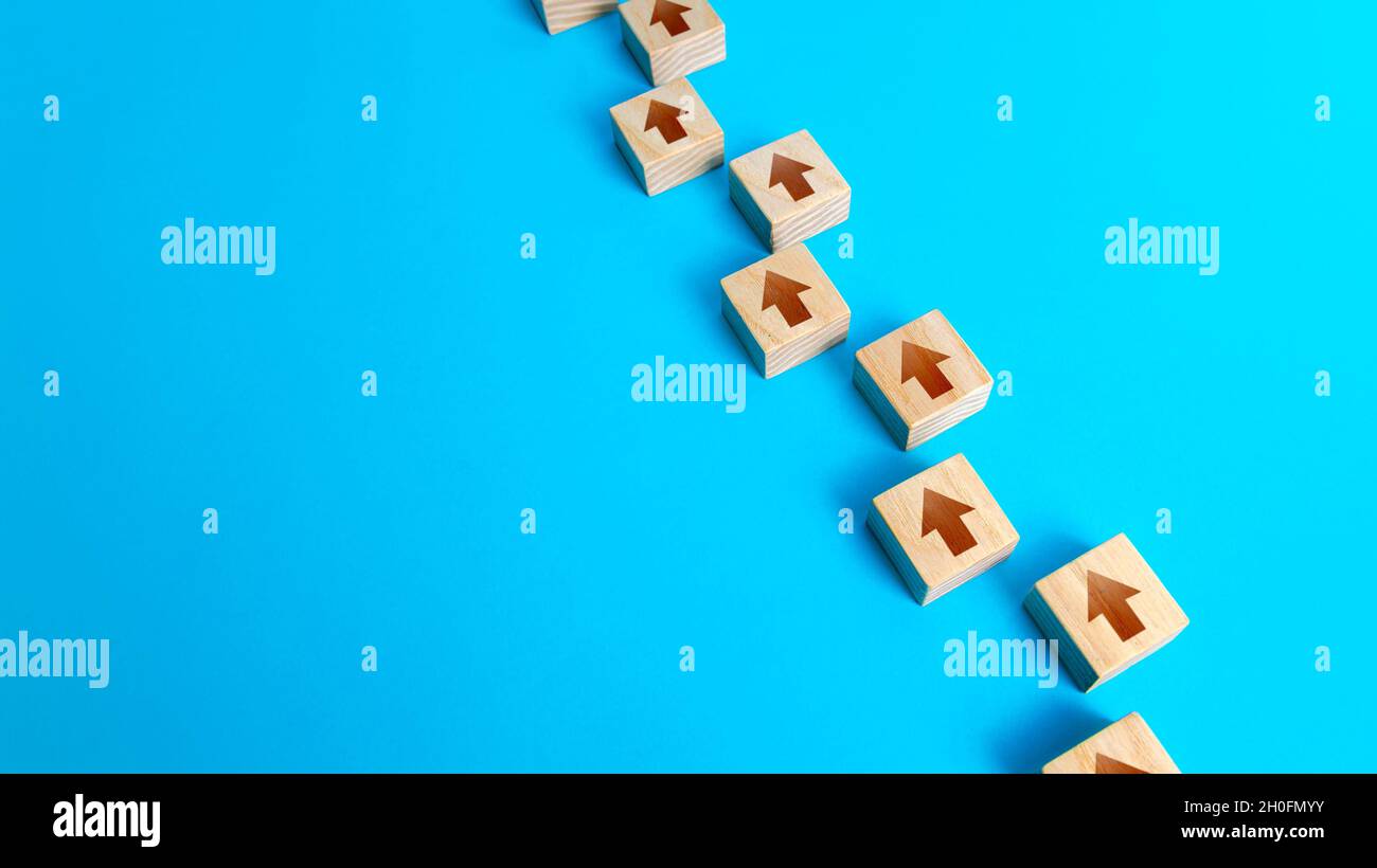 Chain of arrows blocks. Consistency and focus. Concept of conformism ...