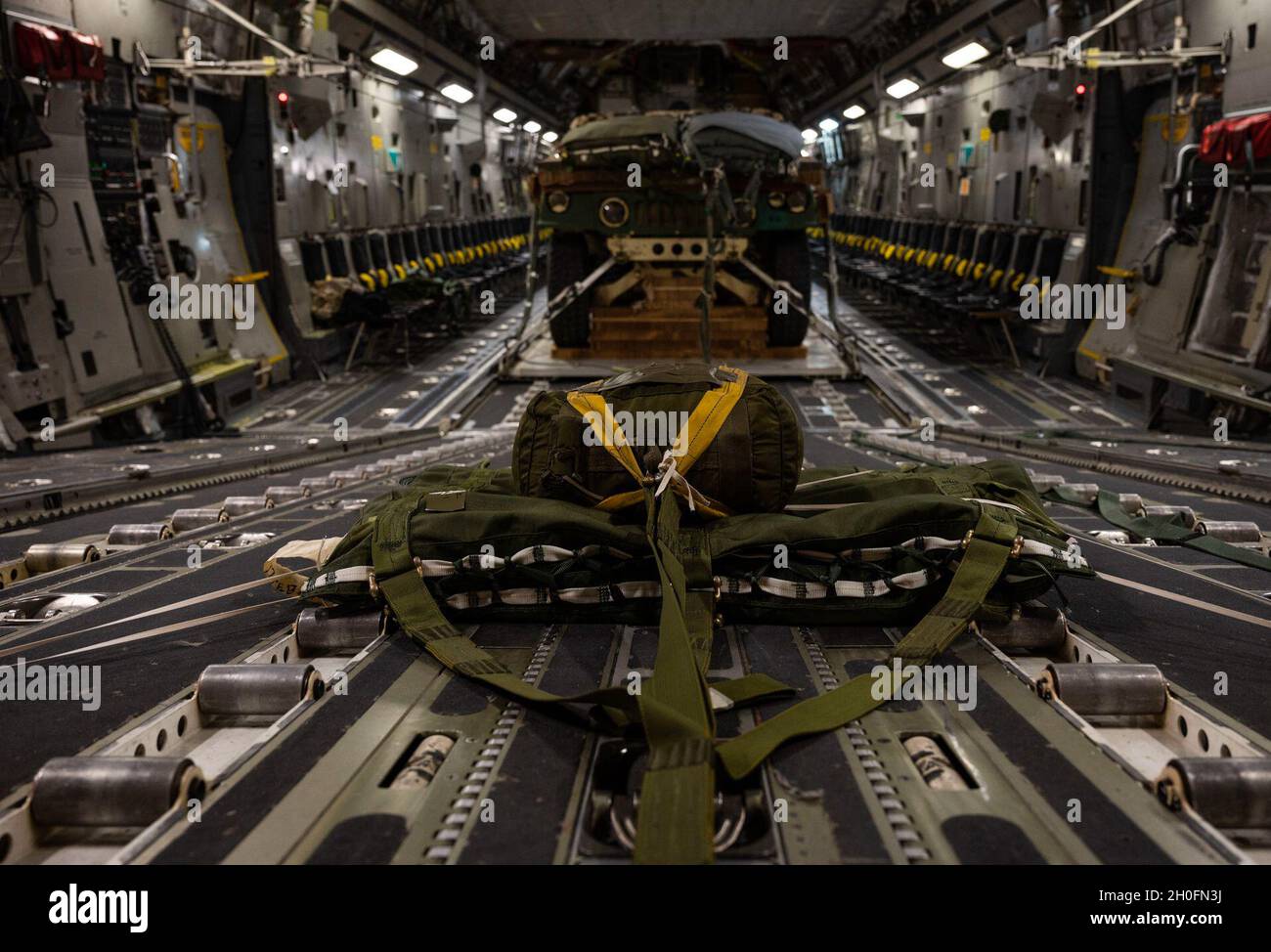A Humvee is loaded onto a C-17 Globemaster III, assigned to the 62nd ...