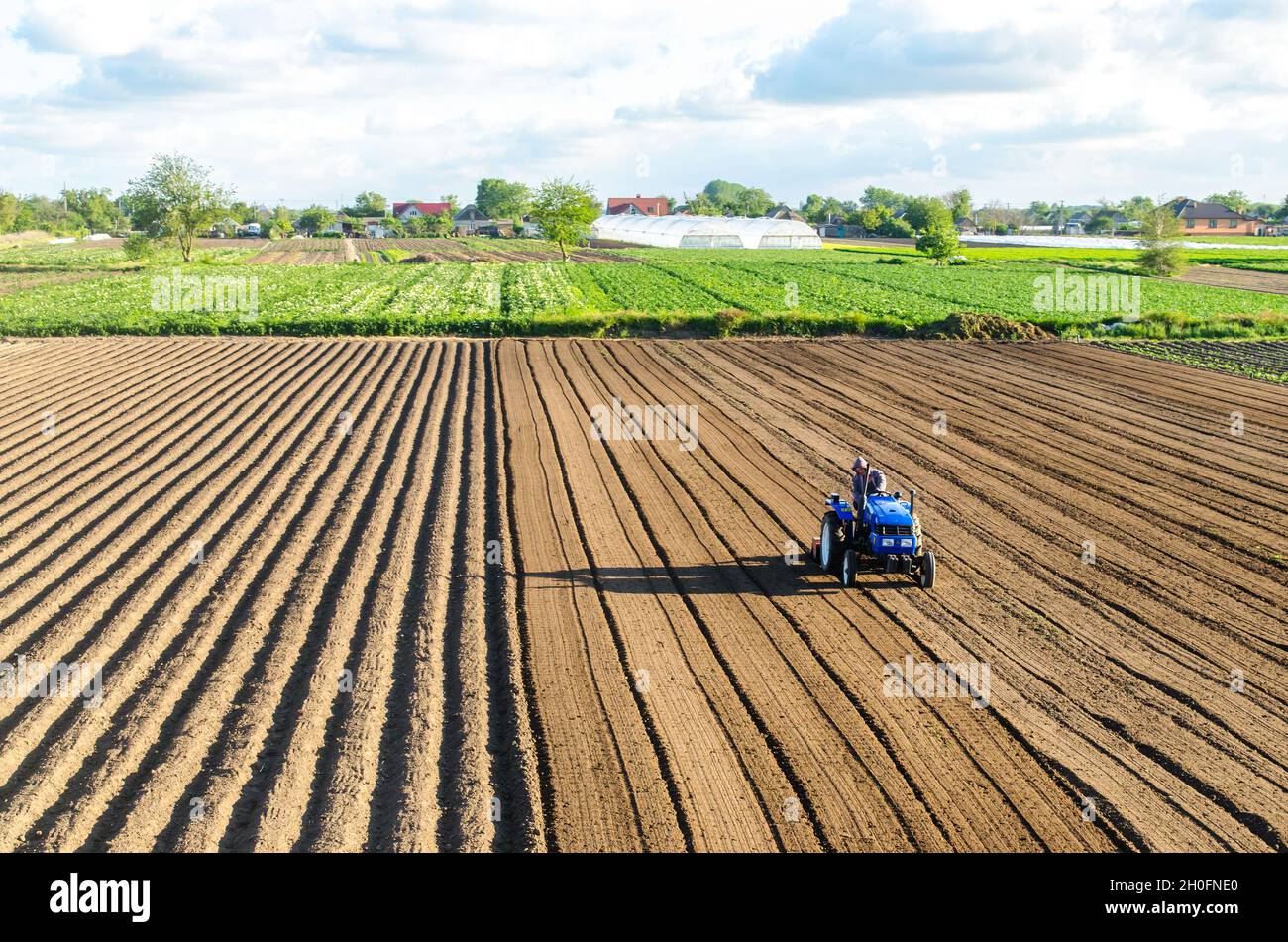 Farmer cultivates land cultivator agriculture hi-res stock photography ...