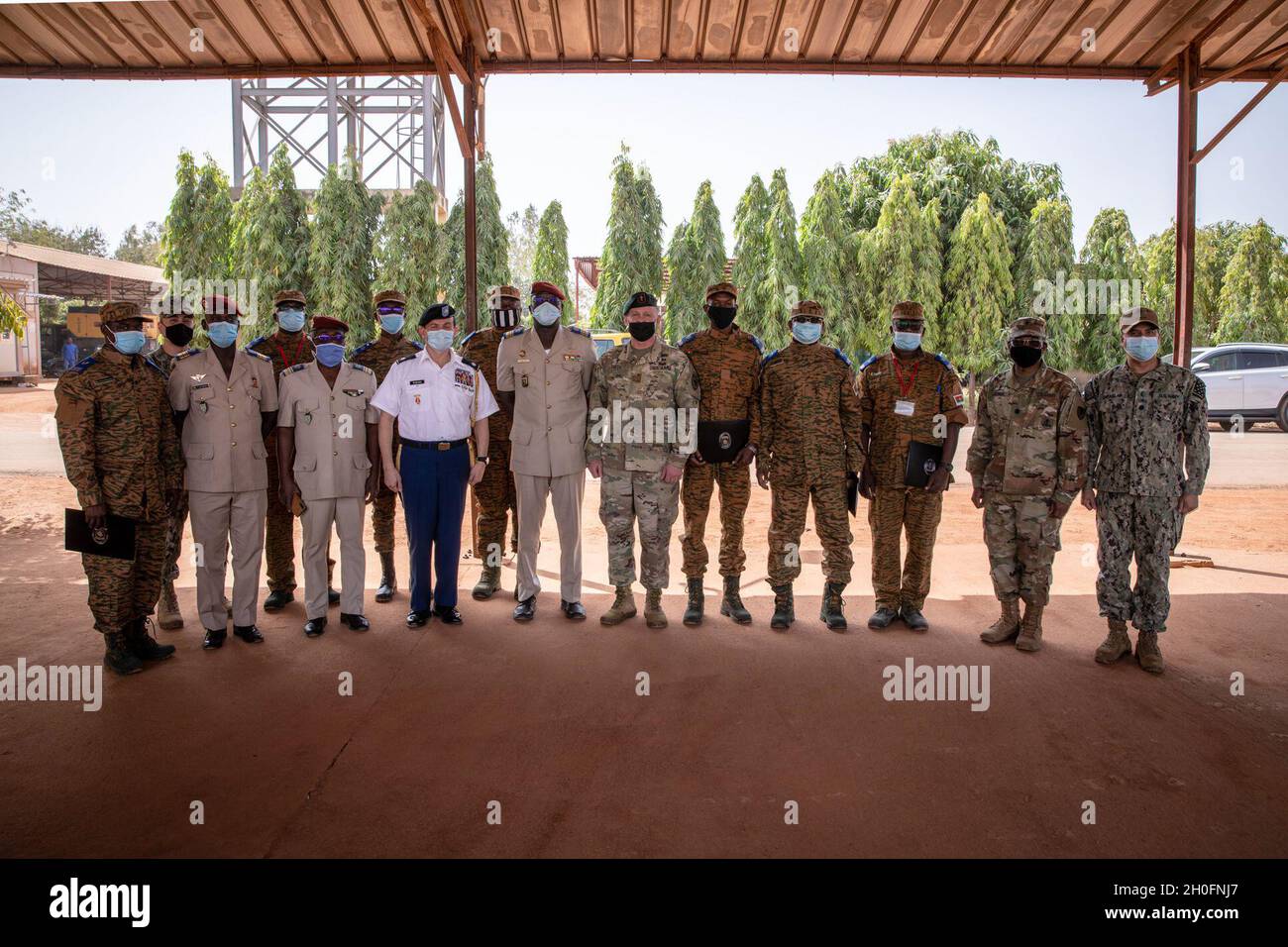 U.S. Army and Burkinabe soldiers take a group photo after the ...
