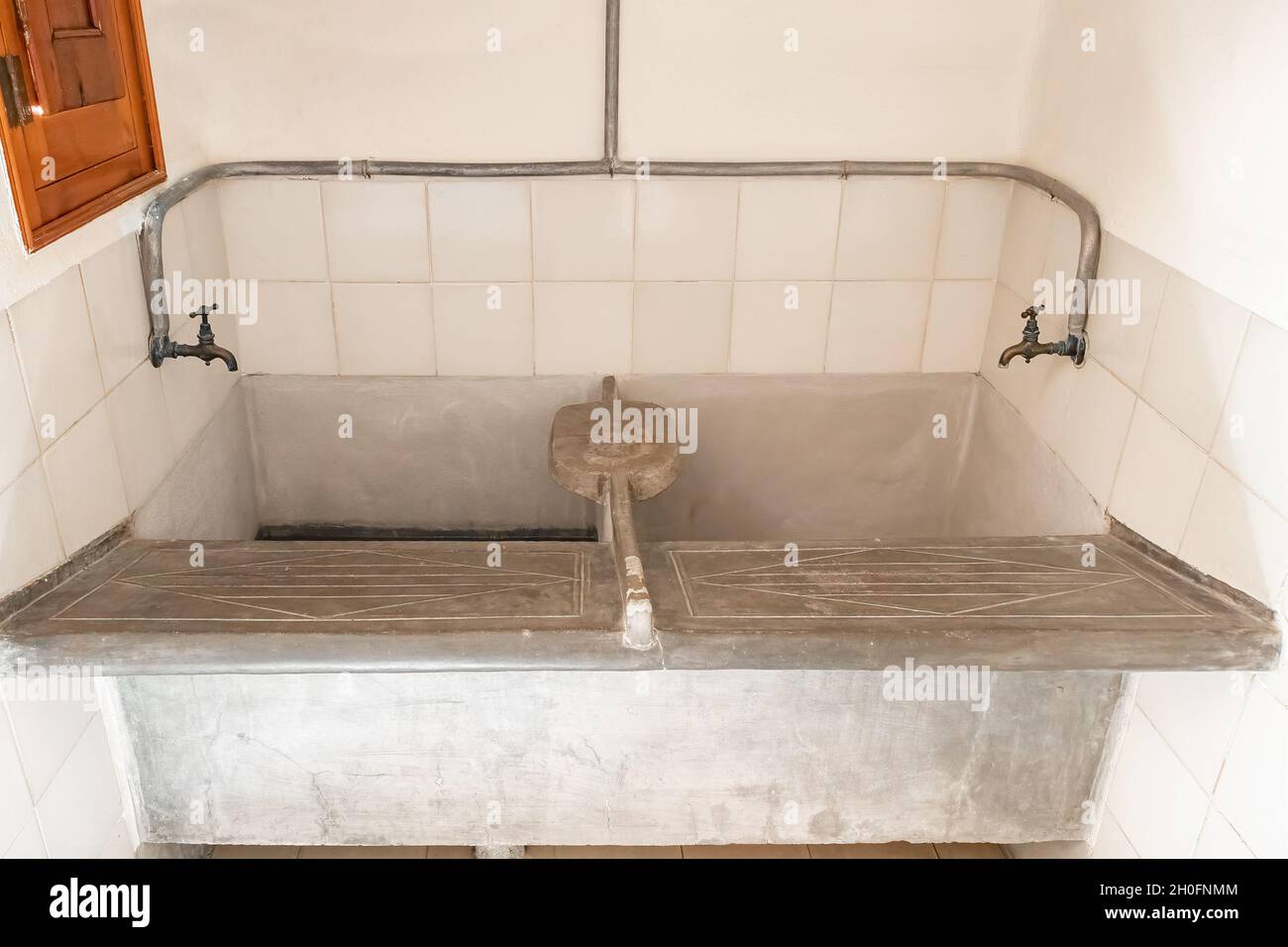 View of an Ancient stone laundry room Stock Photo - Alamy