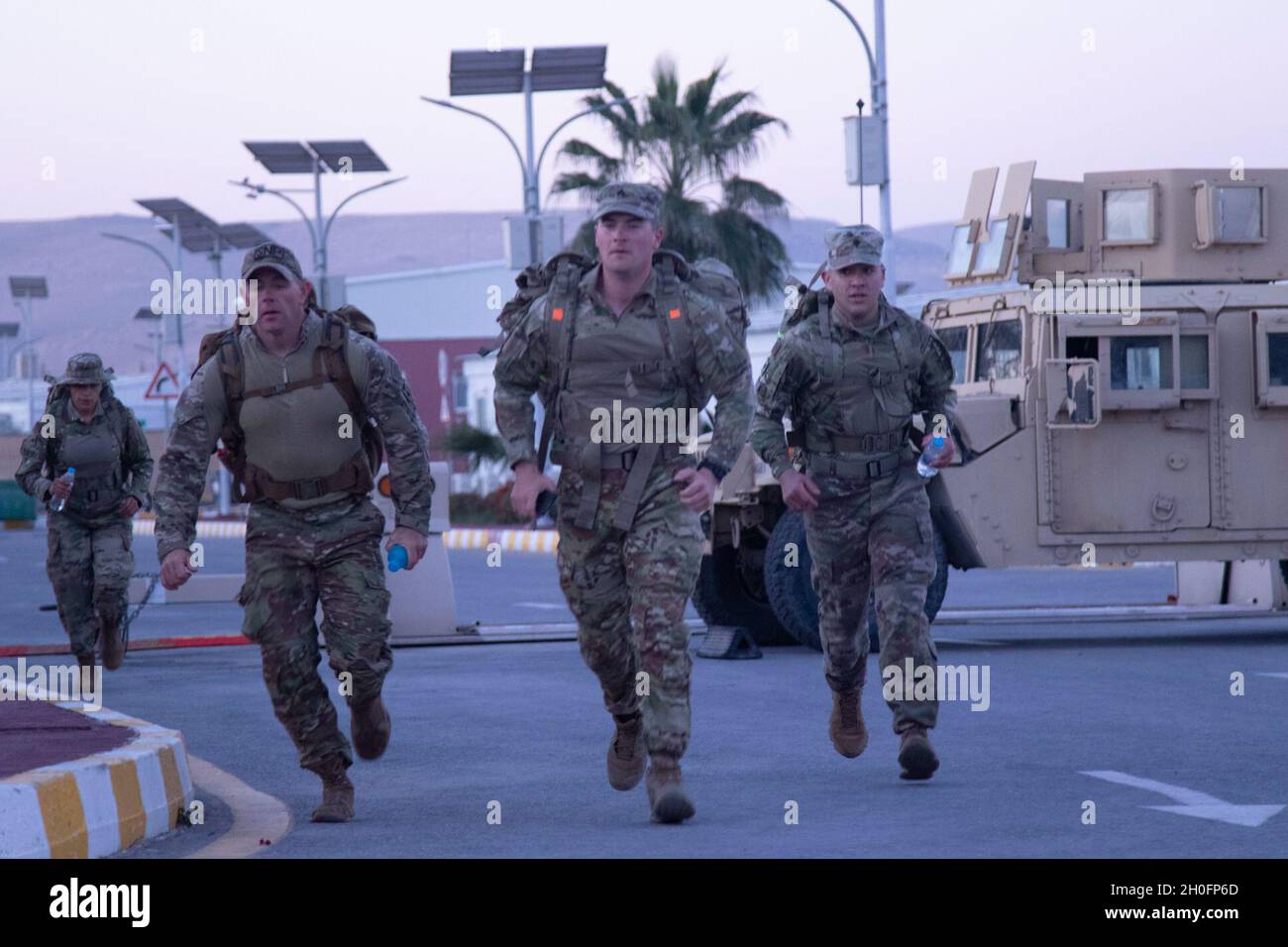 Three Soldiers increase their pace during the Norwegian Foot March at ...