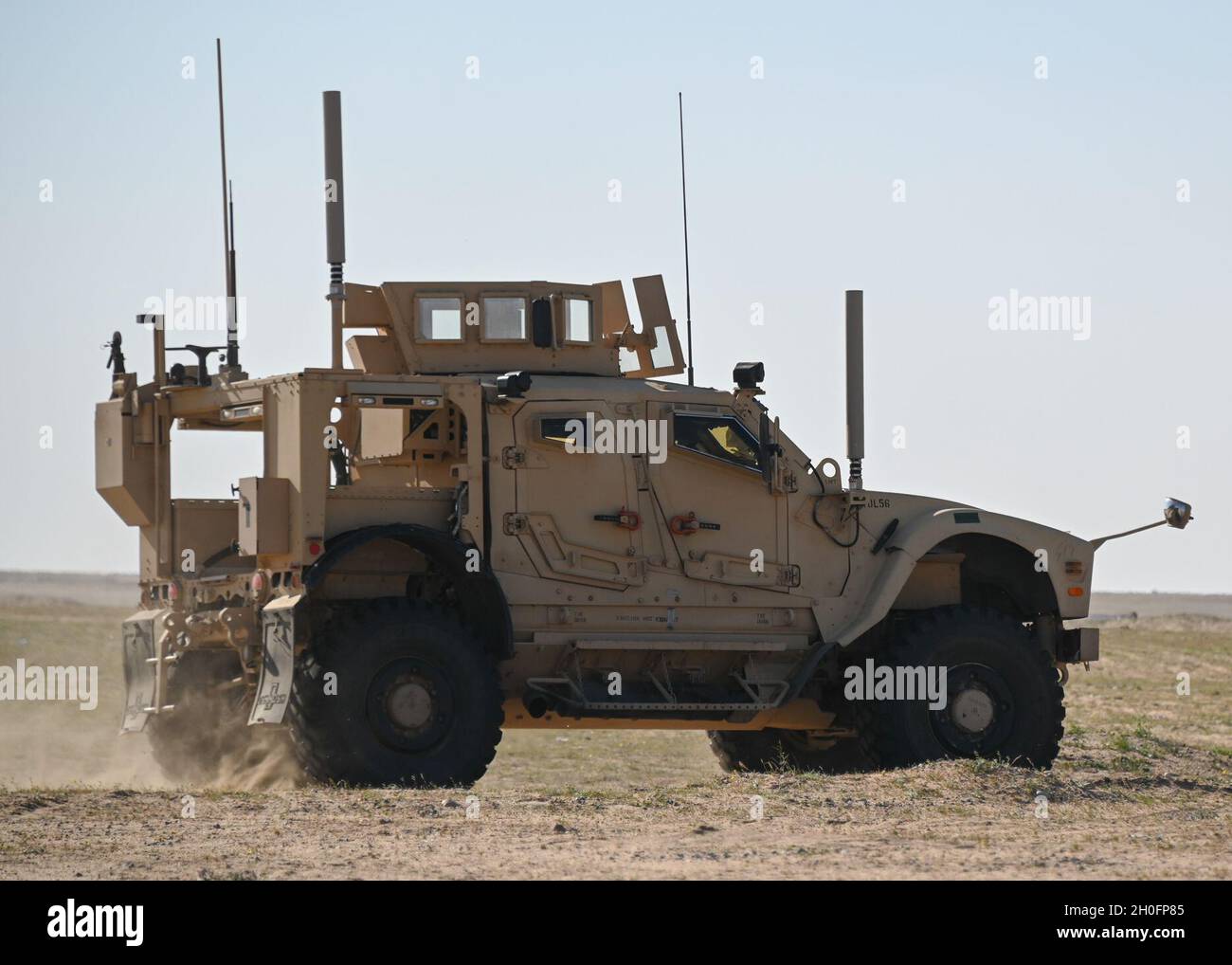 A U.S. Air Force high mobility multipurpose vehicle drives across the ...