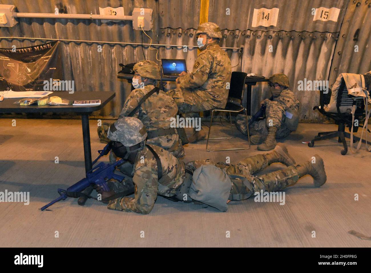 Airmen from the 78th Air Base Wing take defensive positions inside a ...