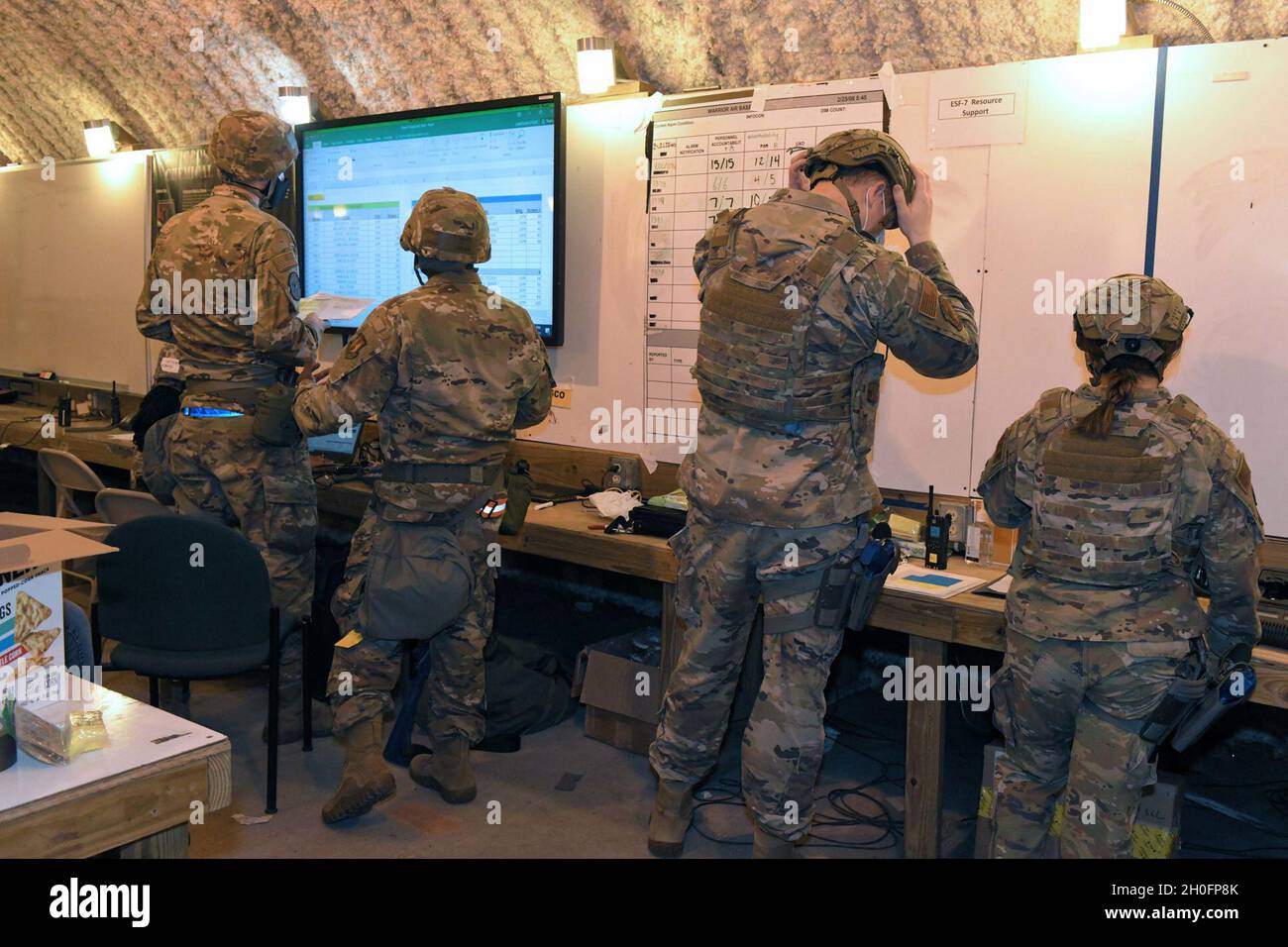 Airmen monitor the Emergency Status Board in the Emergency Operations ...