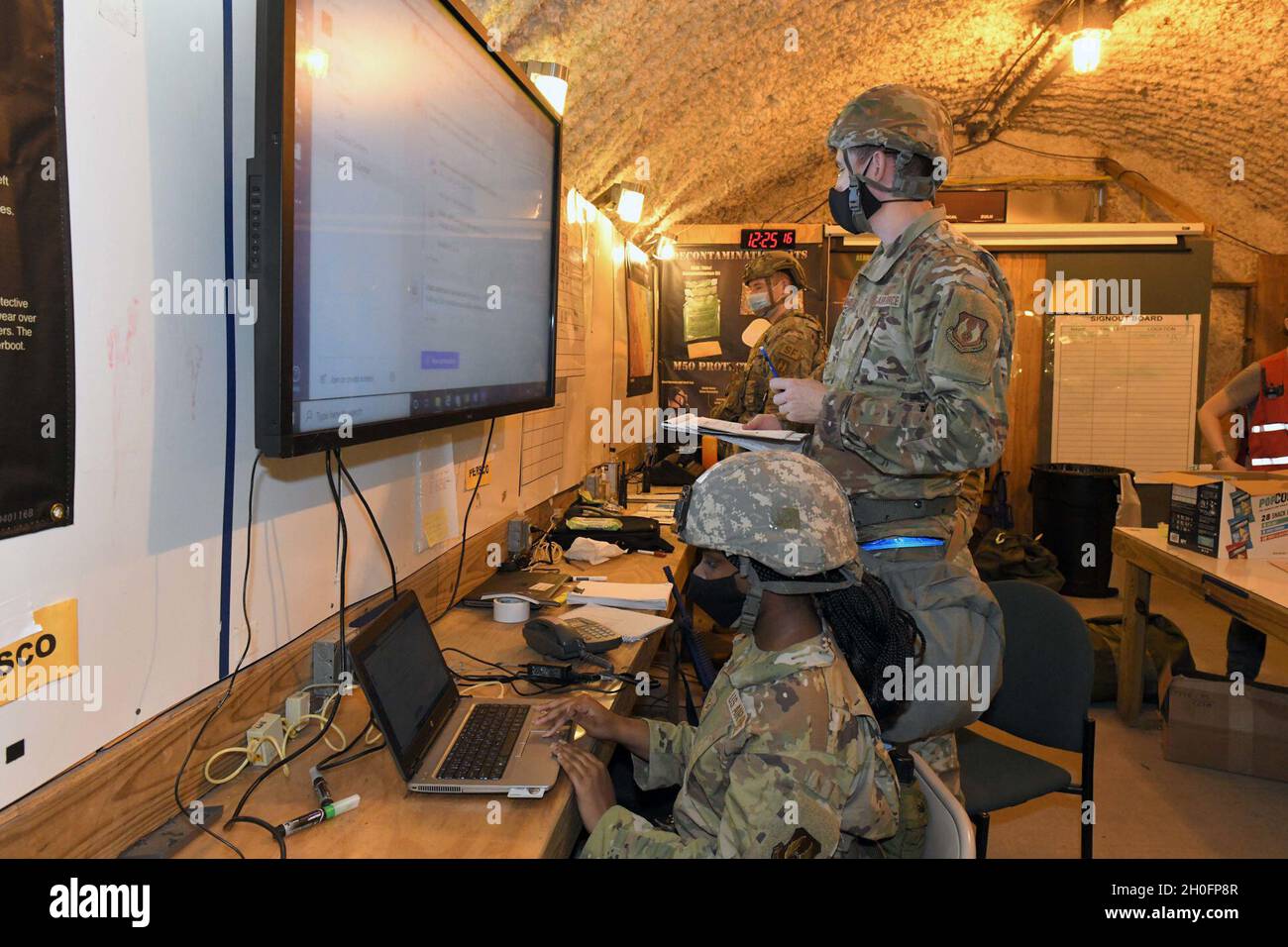 Airmen monitor the Emergency Status Board in the Emergency Operations ...