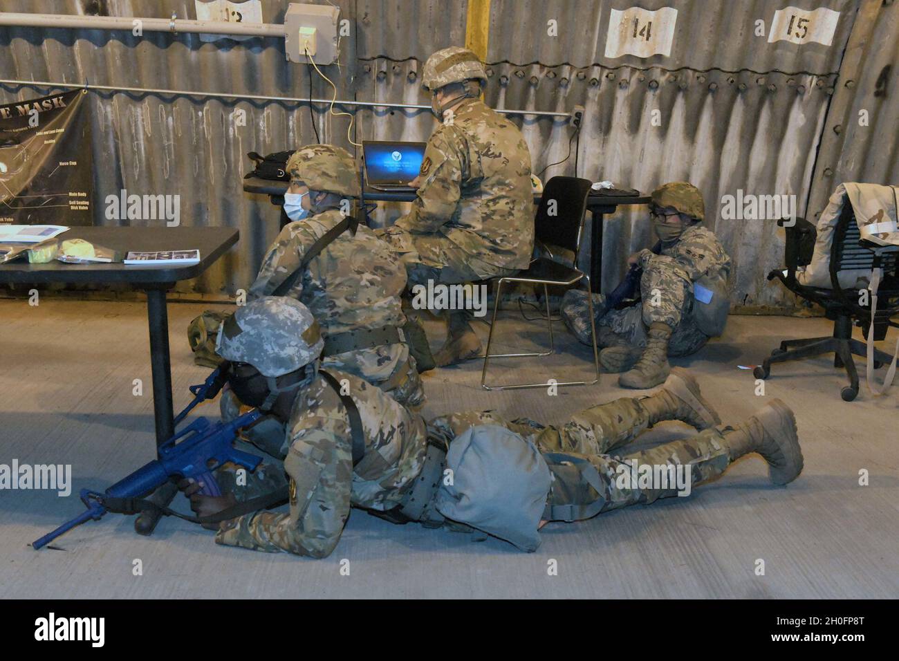 Airmen from the 78th Air Base Wing take defensive positions inside a ...