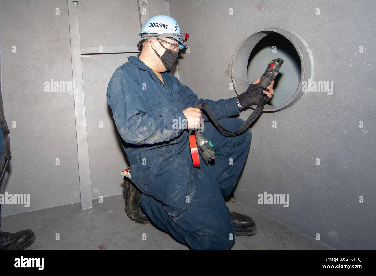 SurgeMain (Surge Maintenance) Sailors checking the air for gas in the ...
