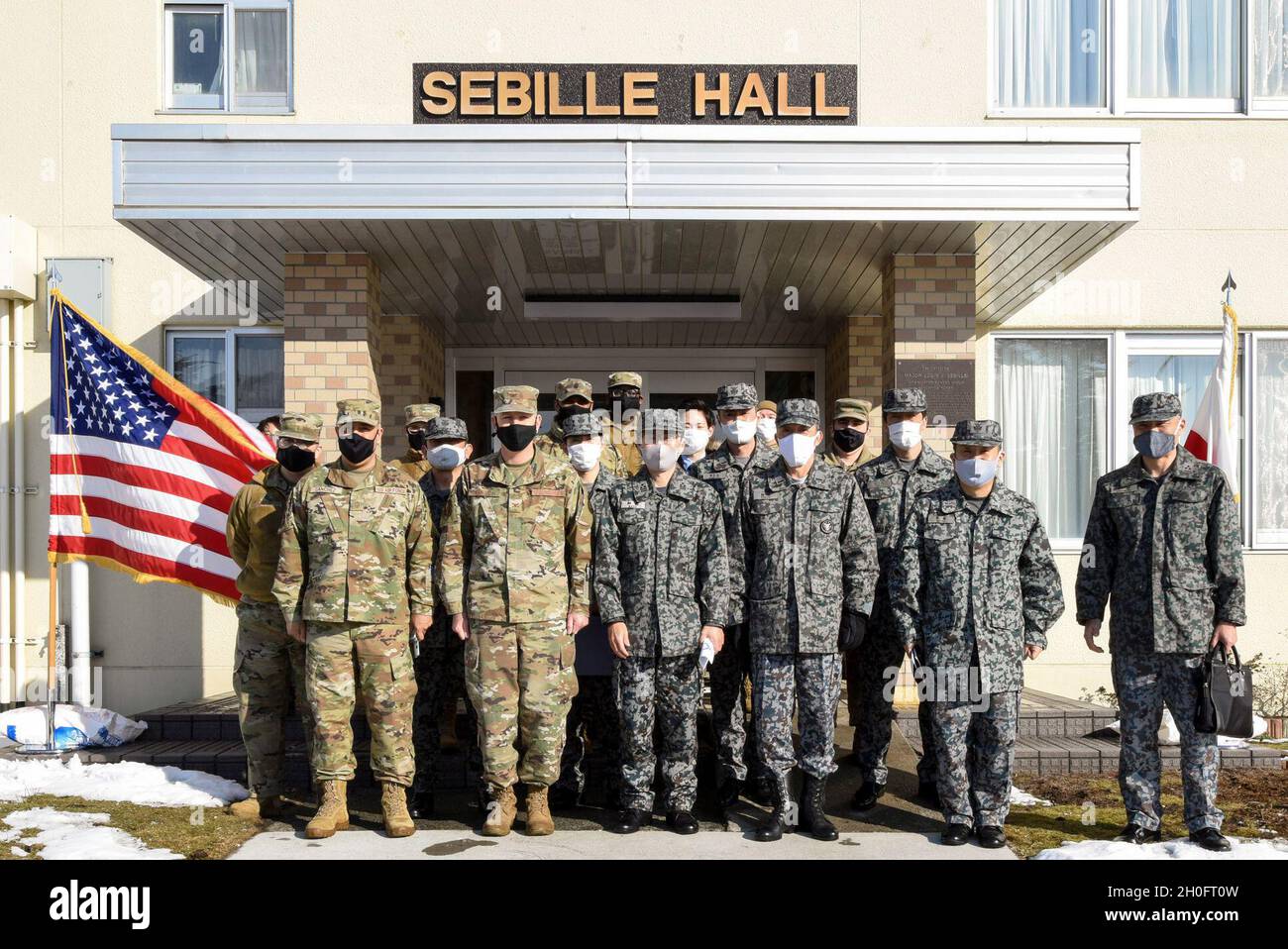 U.S. and Japanese Airmen pose for a group photo after touring the 35th ...