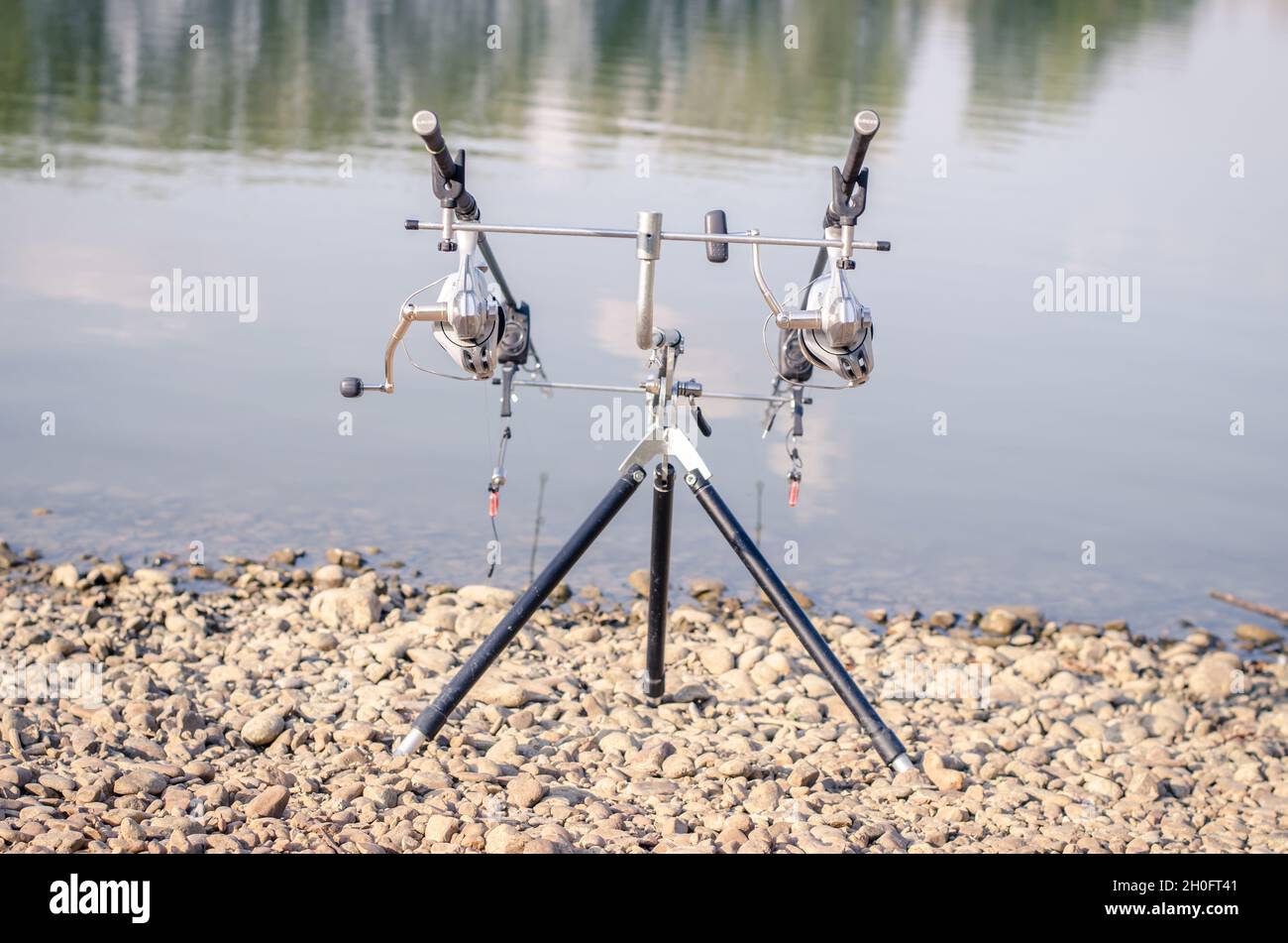 double fishing rod at the pond Stock Photo - Alamy
