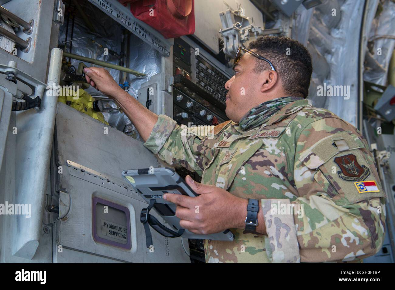 Staff Sergeant Christopher Bucy, a loadmaster from the 300th Airlift ...