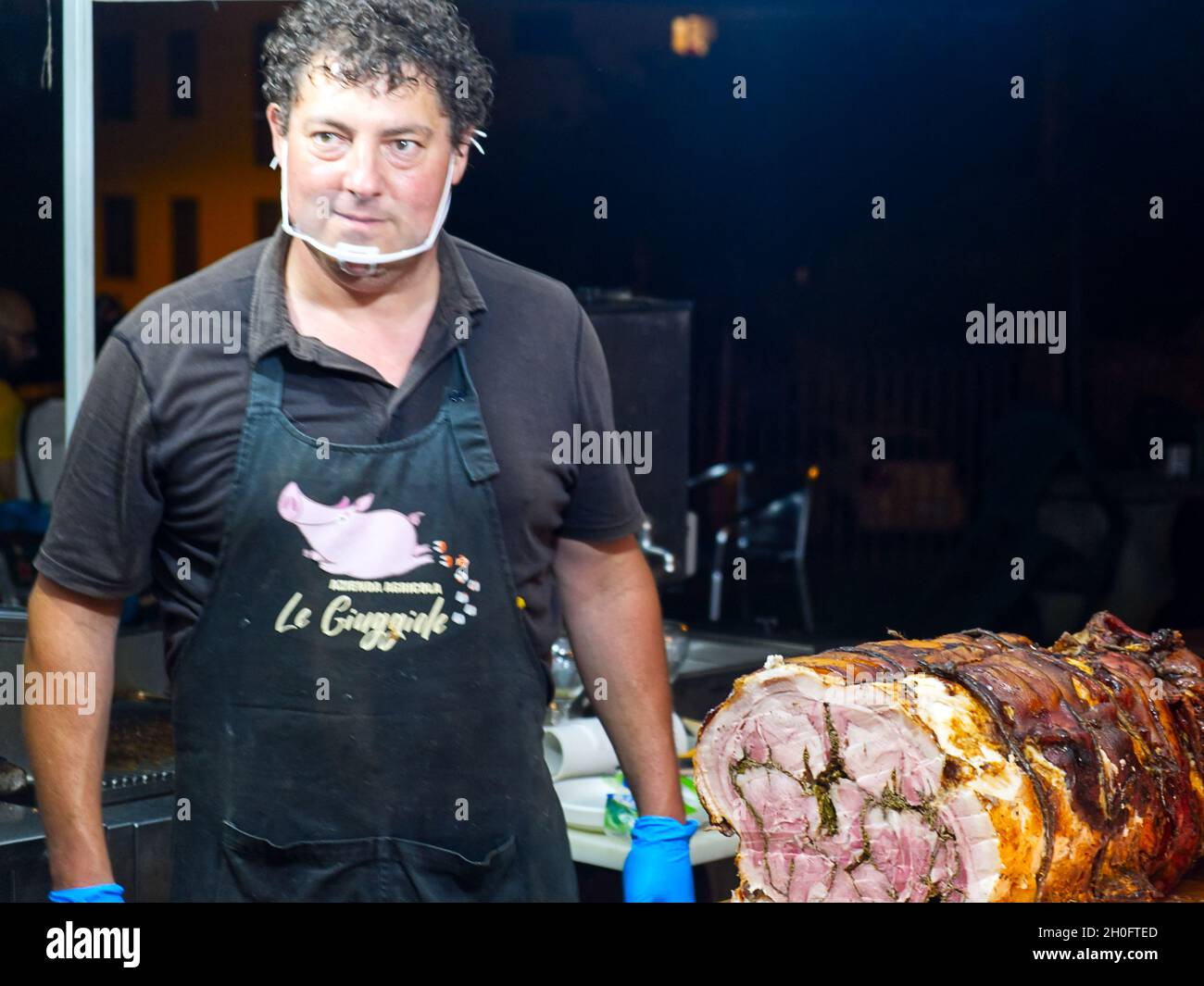 CASTELLAMONTE, ITALY - Jun 22, 2021: A closeup of a man selling typical ...