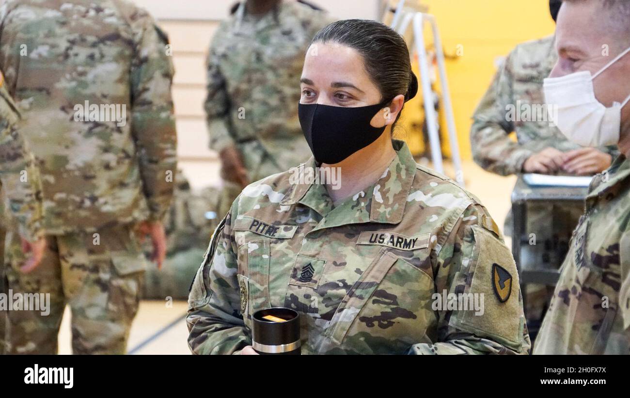 IMCOM-E Command Sgt. Maj. Pitre looks on at the soldiers as they layout ...