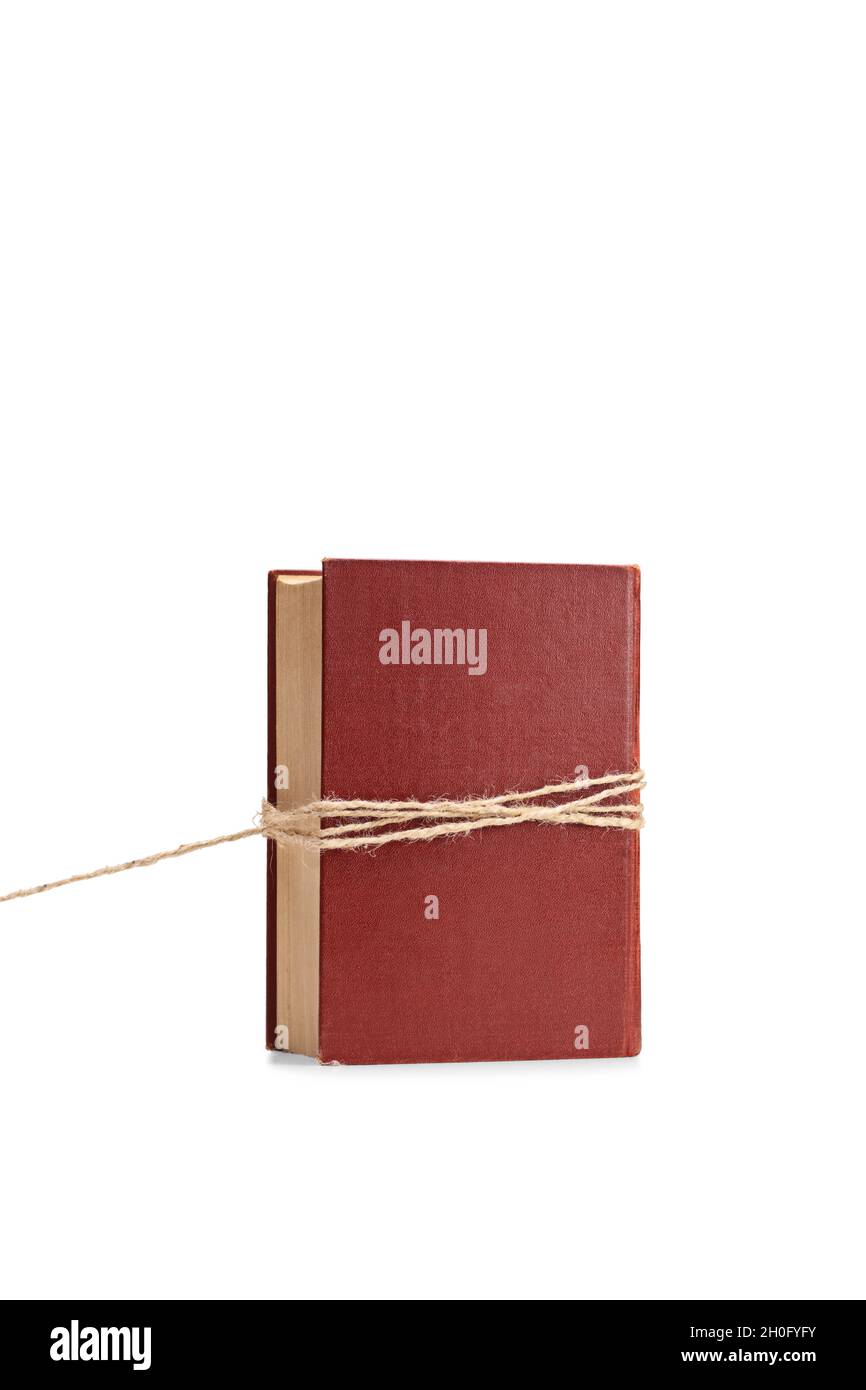 Studio shot of a book with a red cover tied with a rope isolated on ...