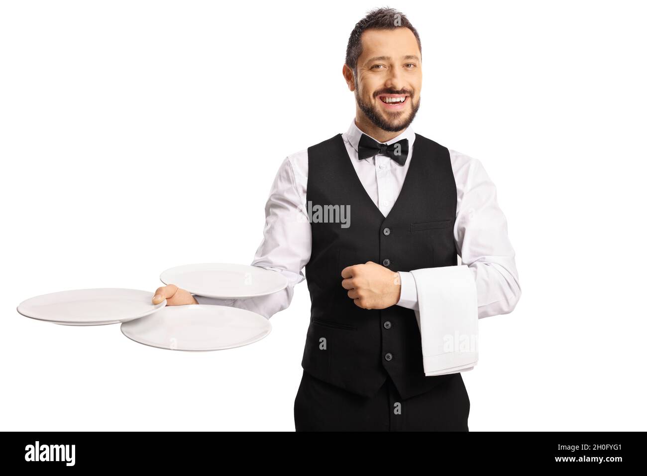 Professional waiter holding three empty plates with one hand and ...
