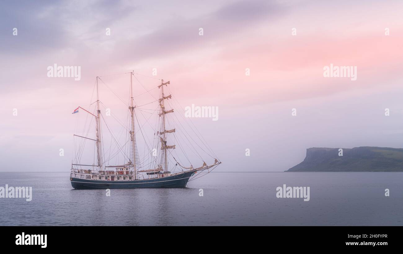 Early morning, beautiful tall ship anchored near Northern Ireland coast ...