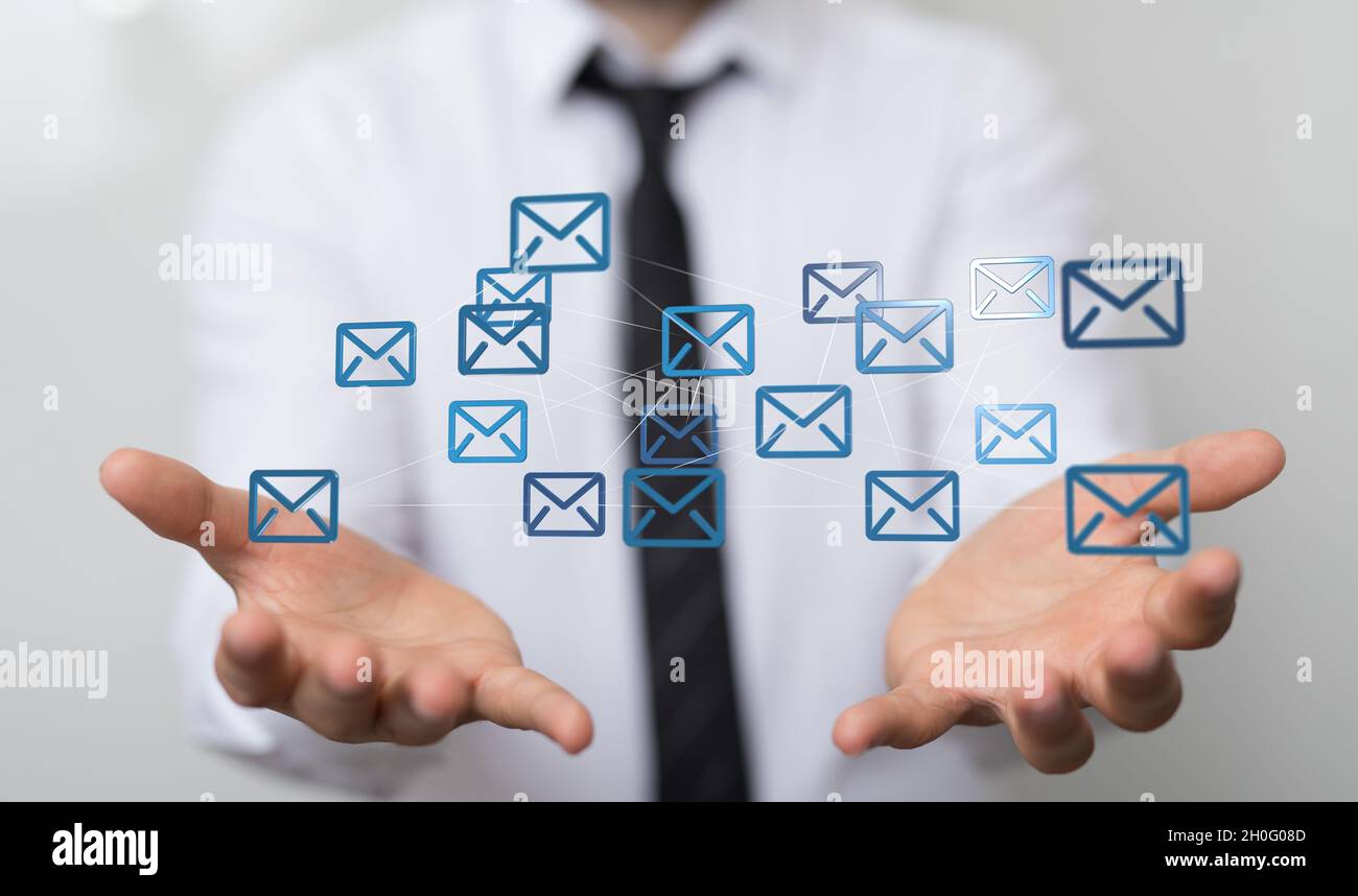 3D rendering of email icons floating on a man's hand against a blurred ...