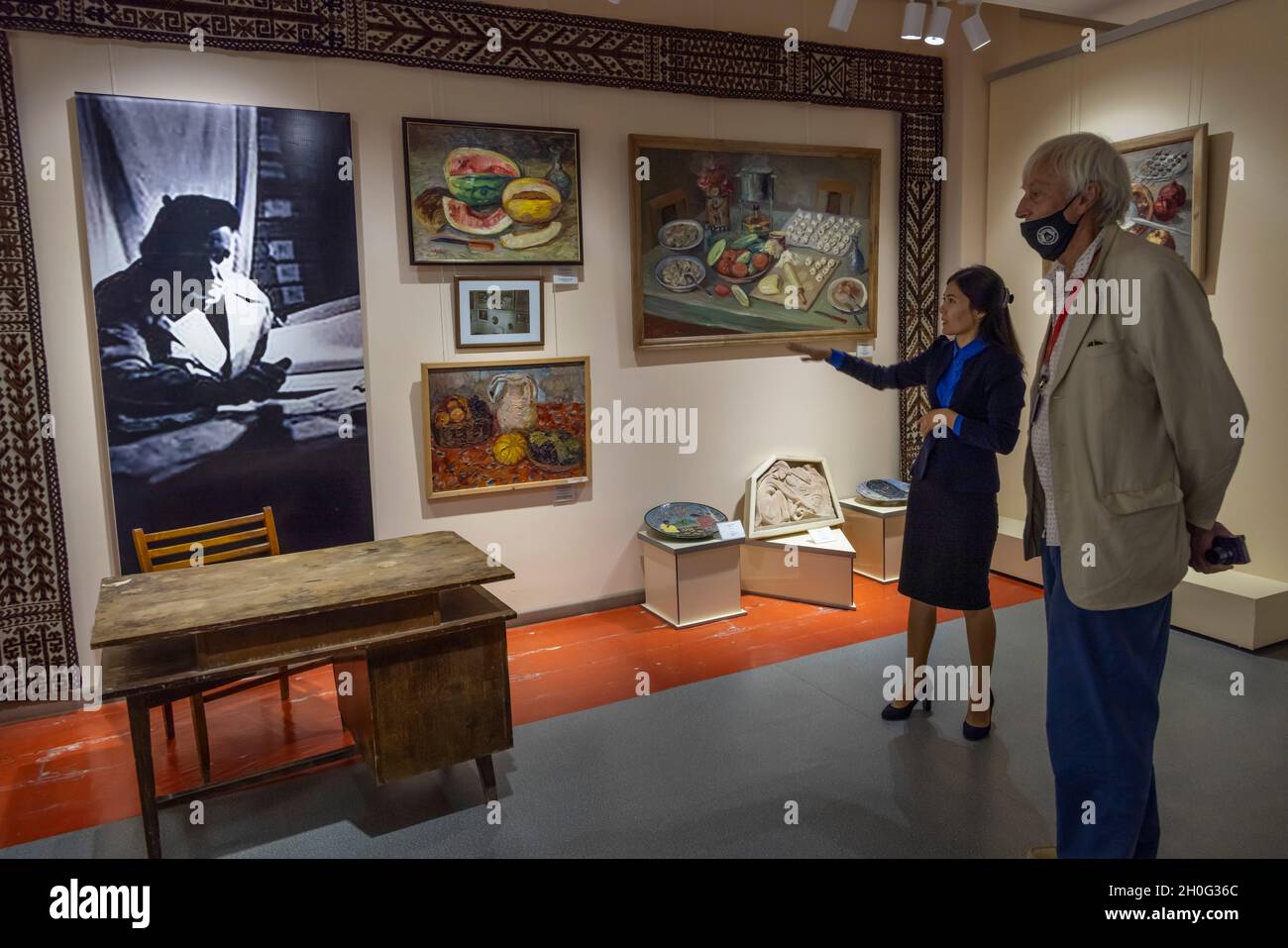 English-speaking female Uzbek museum guide and foreign visitors, Nukus ...