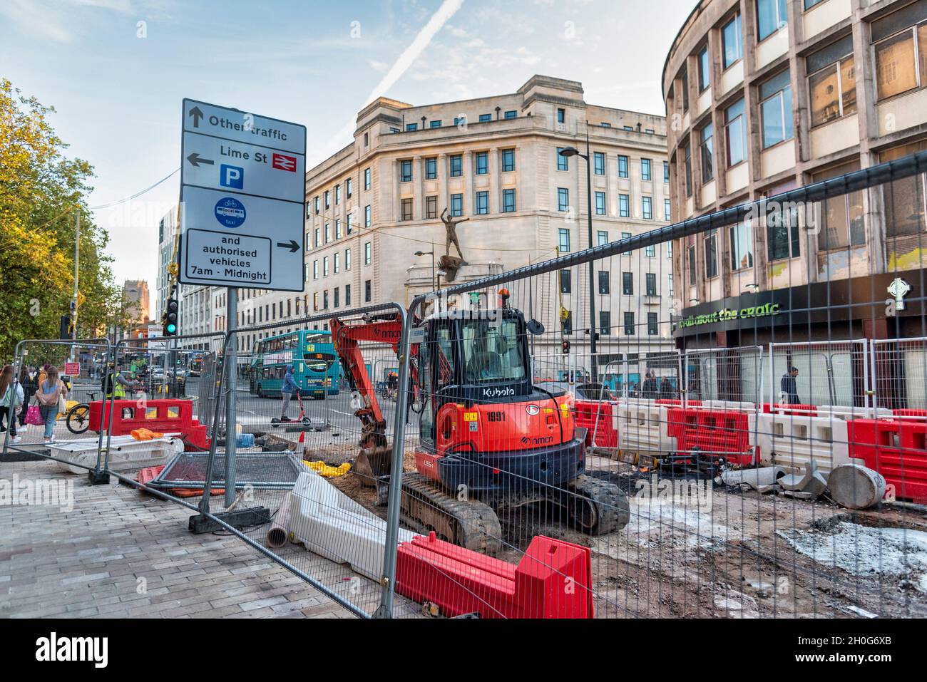 Liverpool, UK. 11th Oct, 2021. A digger sits amongst abandoned street ...