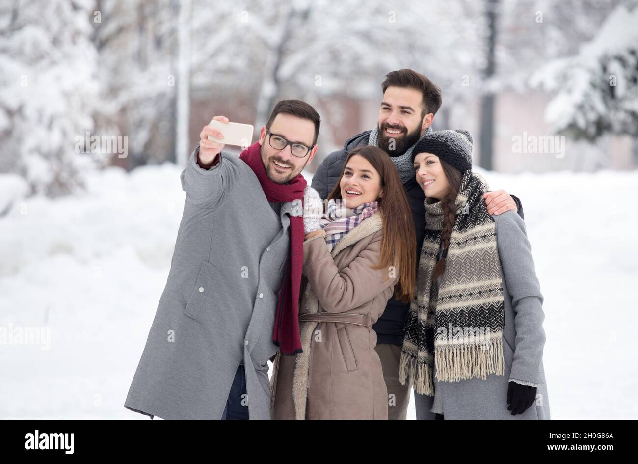 Group happy people enjoying winter hi-res stock photography and images ...