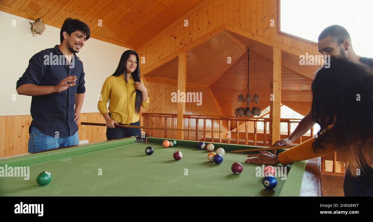 Indian friends are playing pool Stock Photo - Alamy