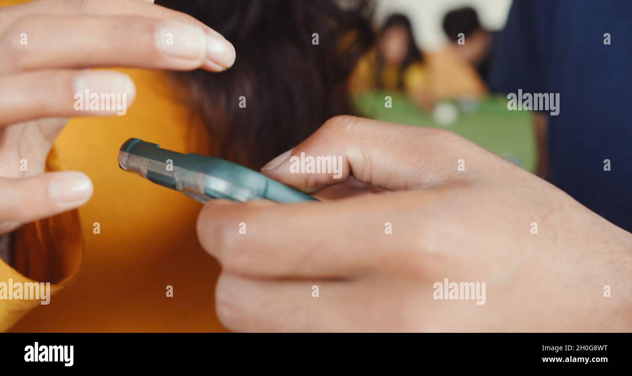 Hands scrolling on the smartphone Stock Photo - Alamy