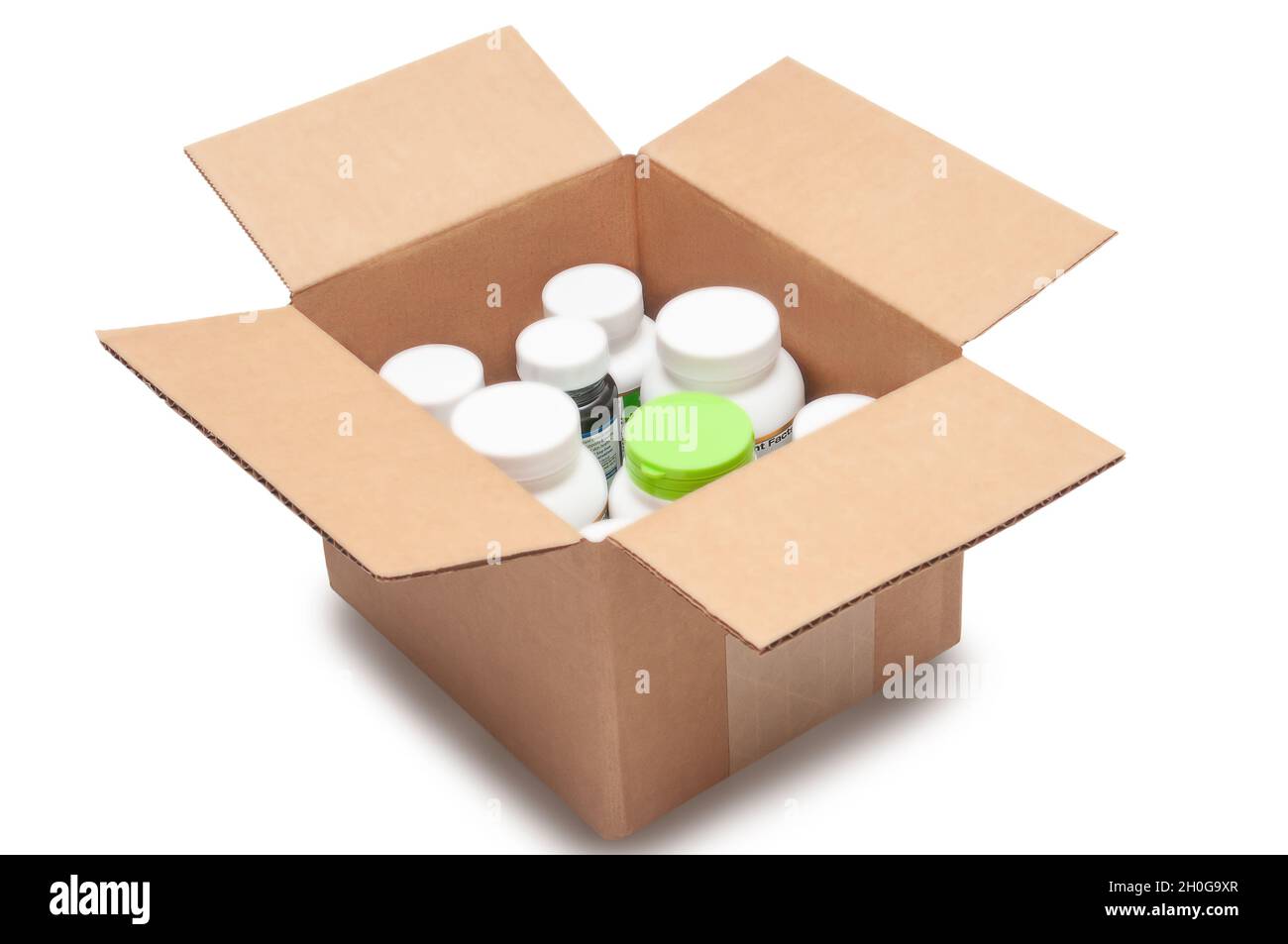 open cardboard box with bottles of medicines and vitamins isolated on ...