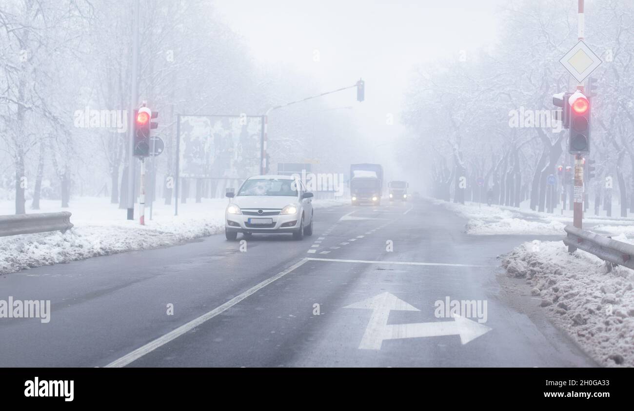 Driving conditions in winter time with cleaned roads and snow around ...