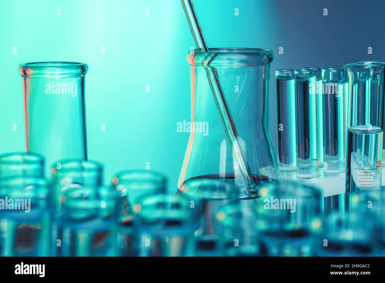 Laboratory chemistry glassware on green toned background Stock Photo ...