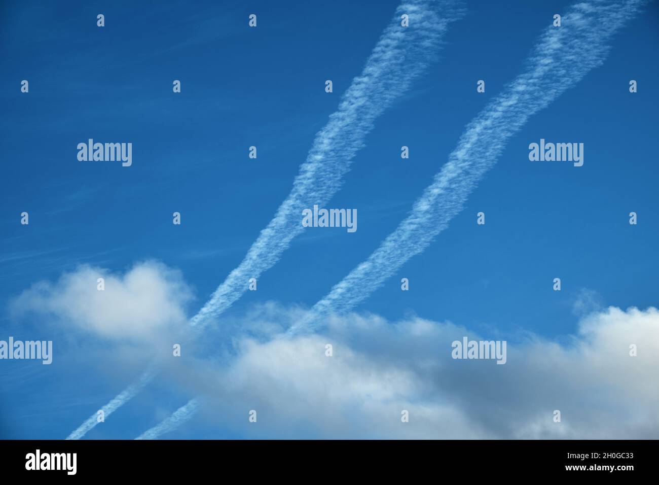 Blue sky and airplane trail. Scotland Stock Photo - Alamy