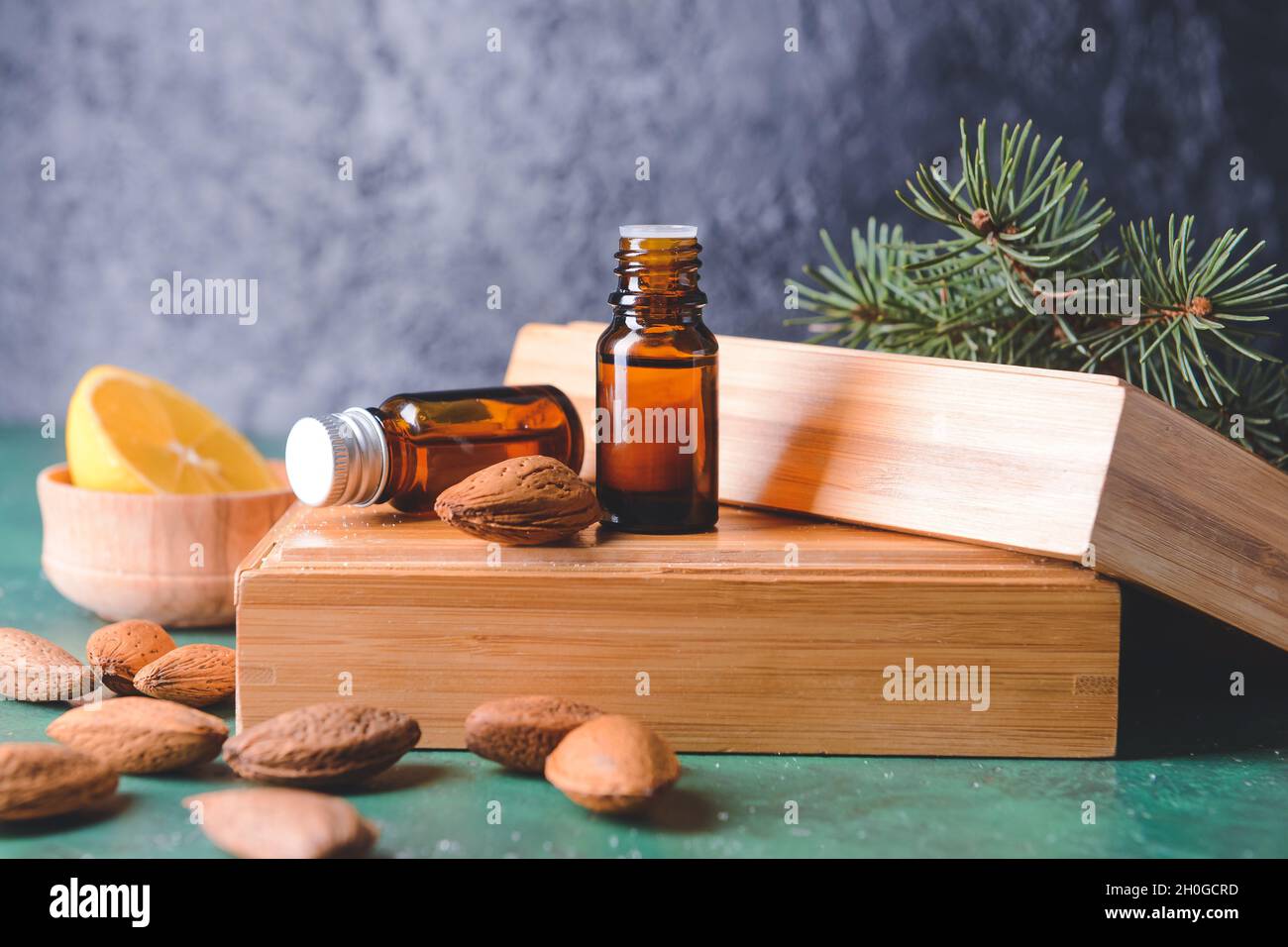 Bottles of essential oil on dark background Stock Photo - Alamy