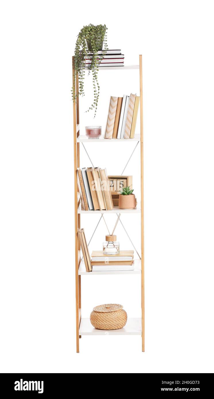 Modern bookcase with decor on white background Stock Photo - Alamy