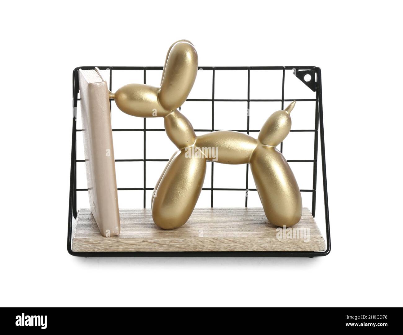 Small hanging book shelf with figurine of balloon dog on white ...