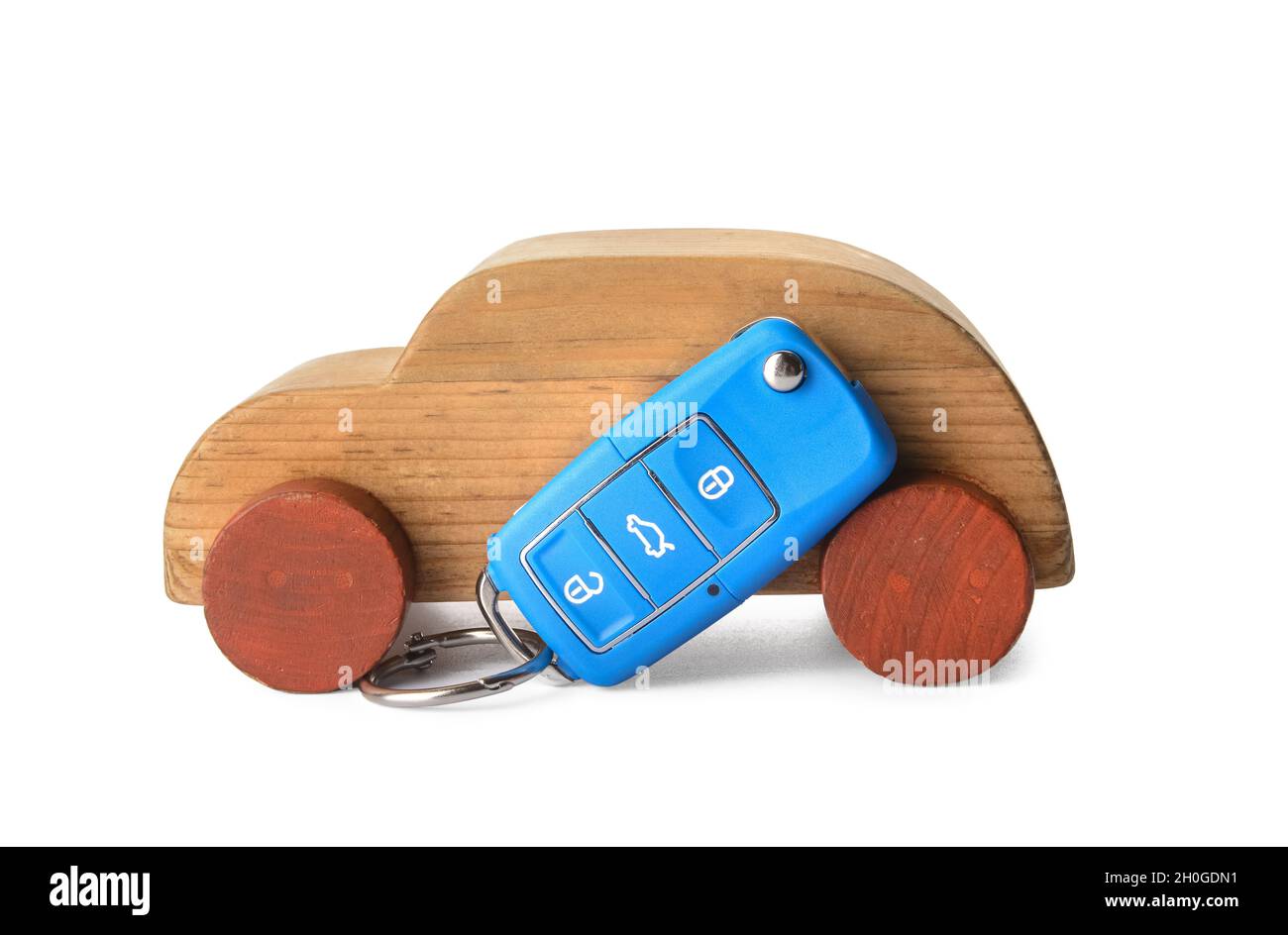 Wooden car with key on white background Stock Photo - Alamy