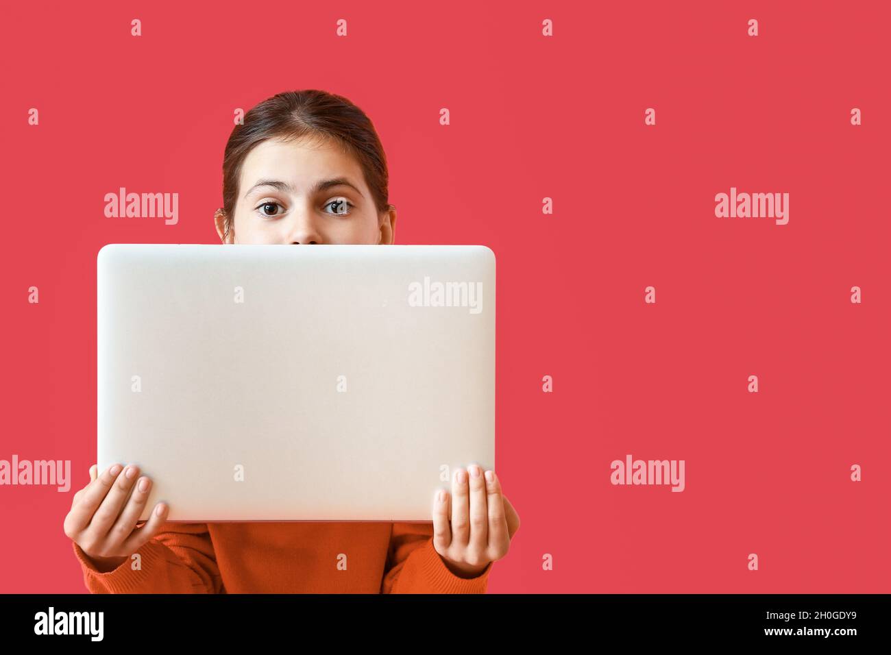 Little programmer with laptop on color background Stock Photo - Alamy