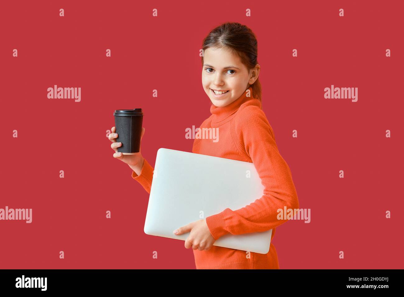 Little programmer with laptop and cup of coffee on color background ...