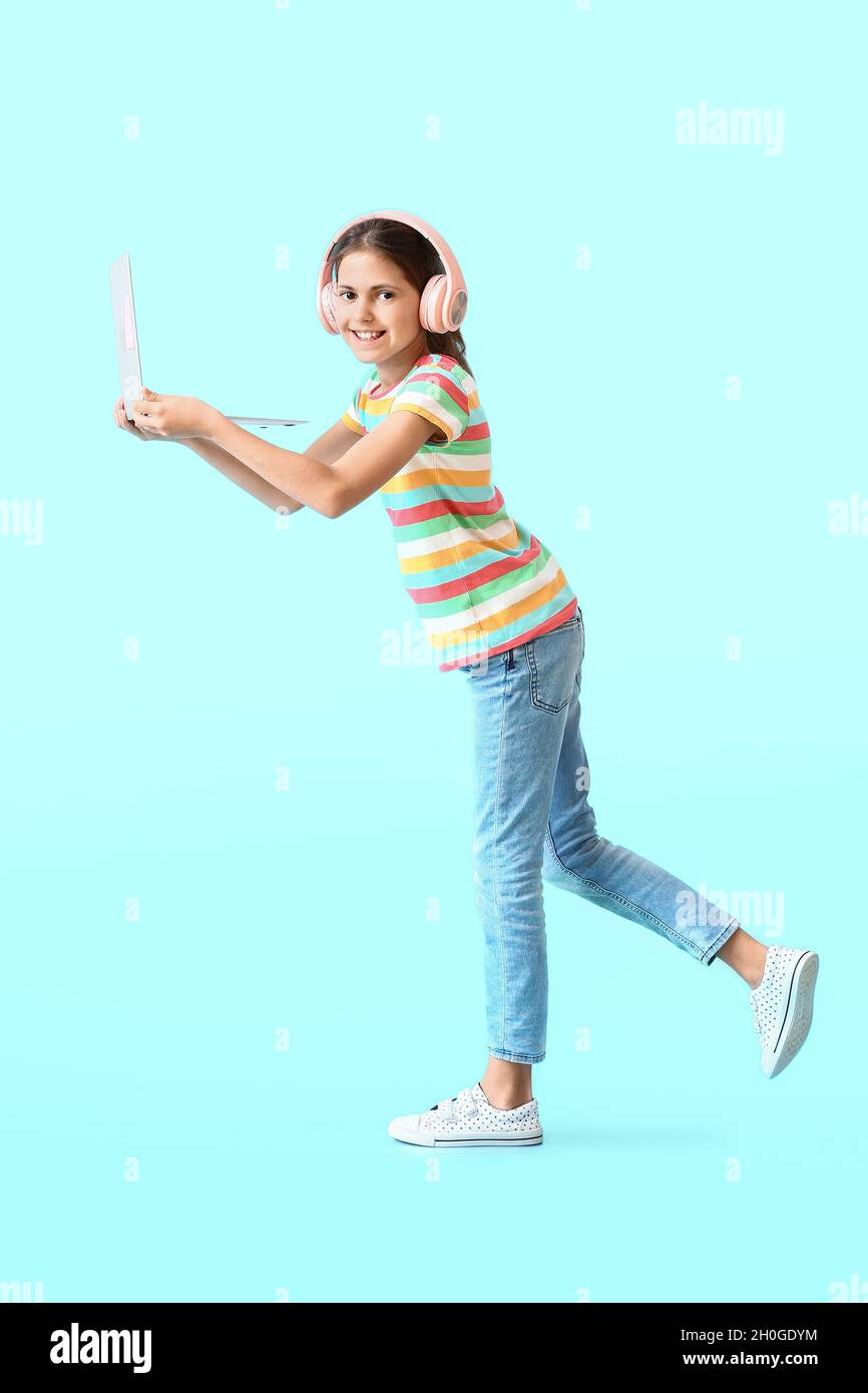 Little programmer with laptop on color background Stock Photo - Alamy