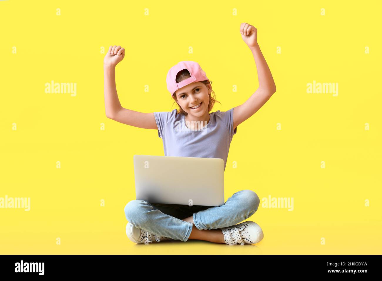 Little programmer with laptop on color background Stock Photo - Alamy