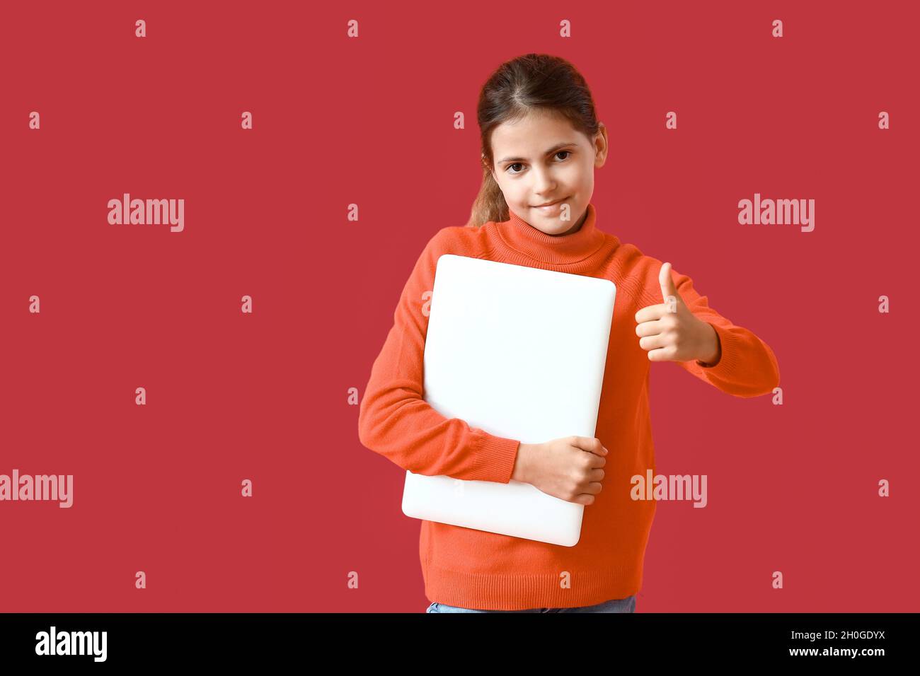 Little programmer with laptop showing thumb-up on color background ...