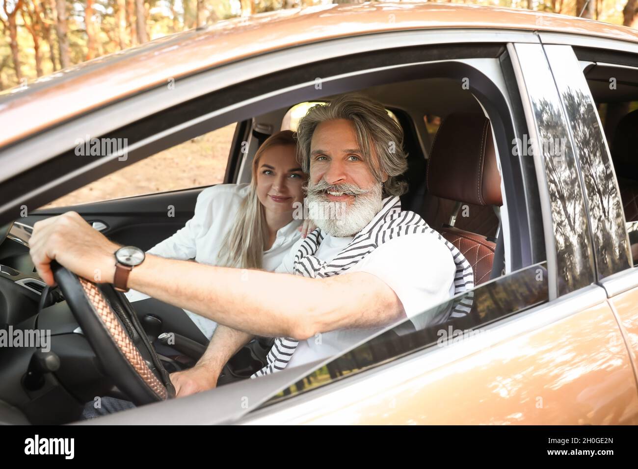 Happy mature couple traveling by car Stock Photo - Alamy