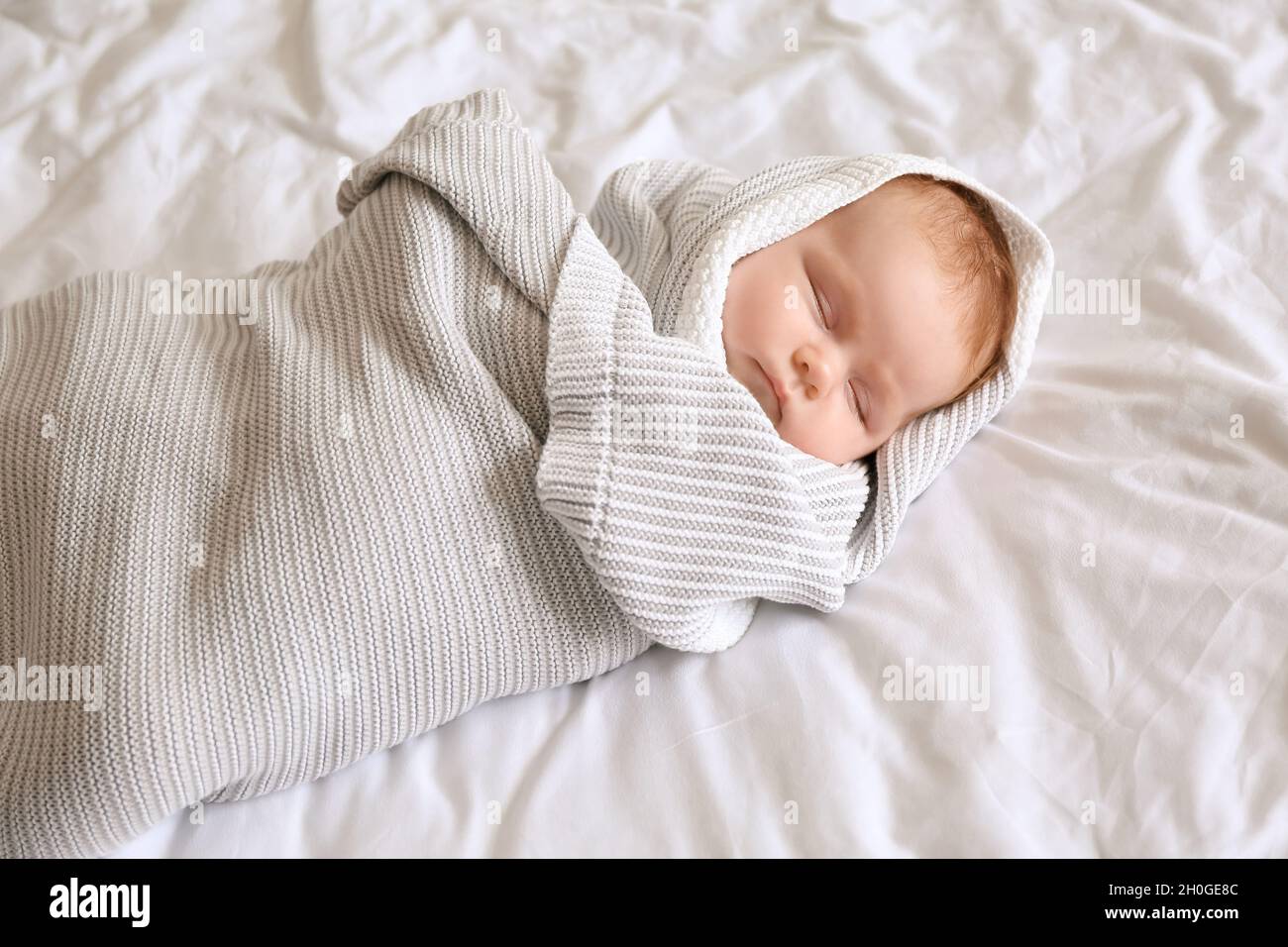 Little baby sleeping on bed Stock Photo - Alamy
