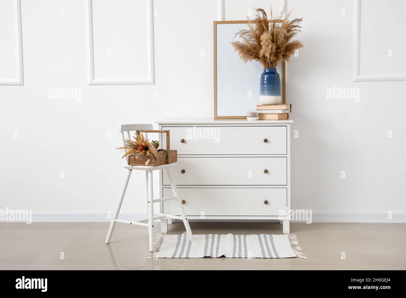 Interior of modern room with chest of drawers Stock Photo - Alamy