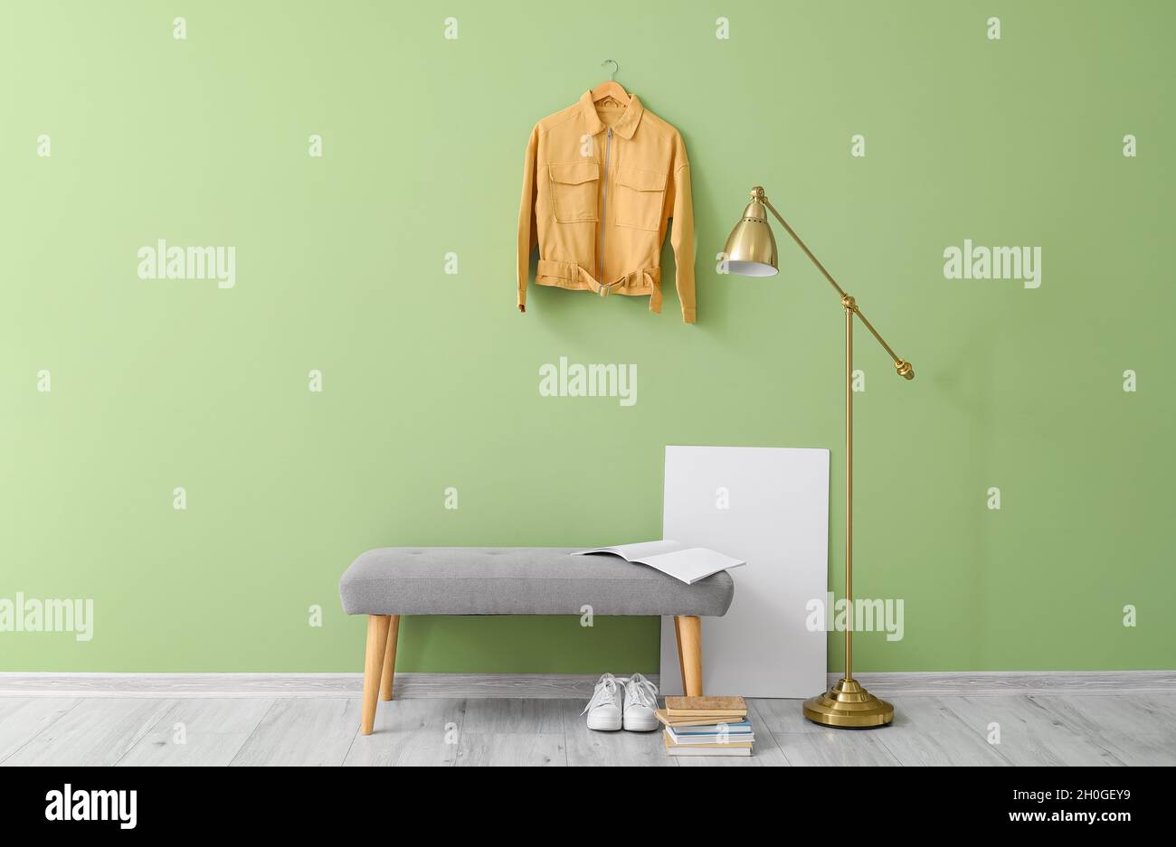 Interior of modern hallway with yellow jacket and green wall Stock ...