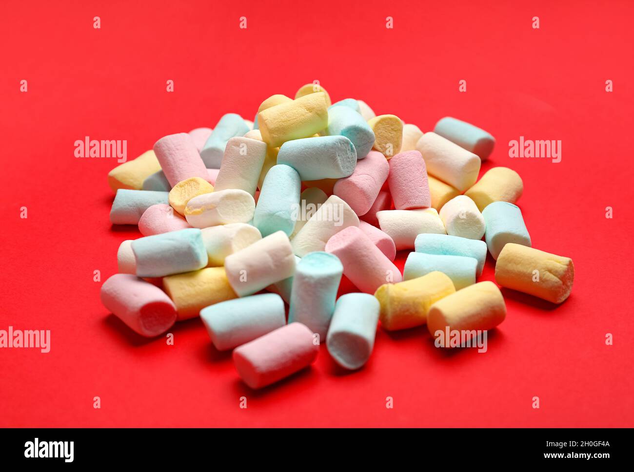 Tasty colorful marshmallows on color background Stock Photo - Alamy