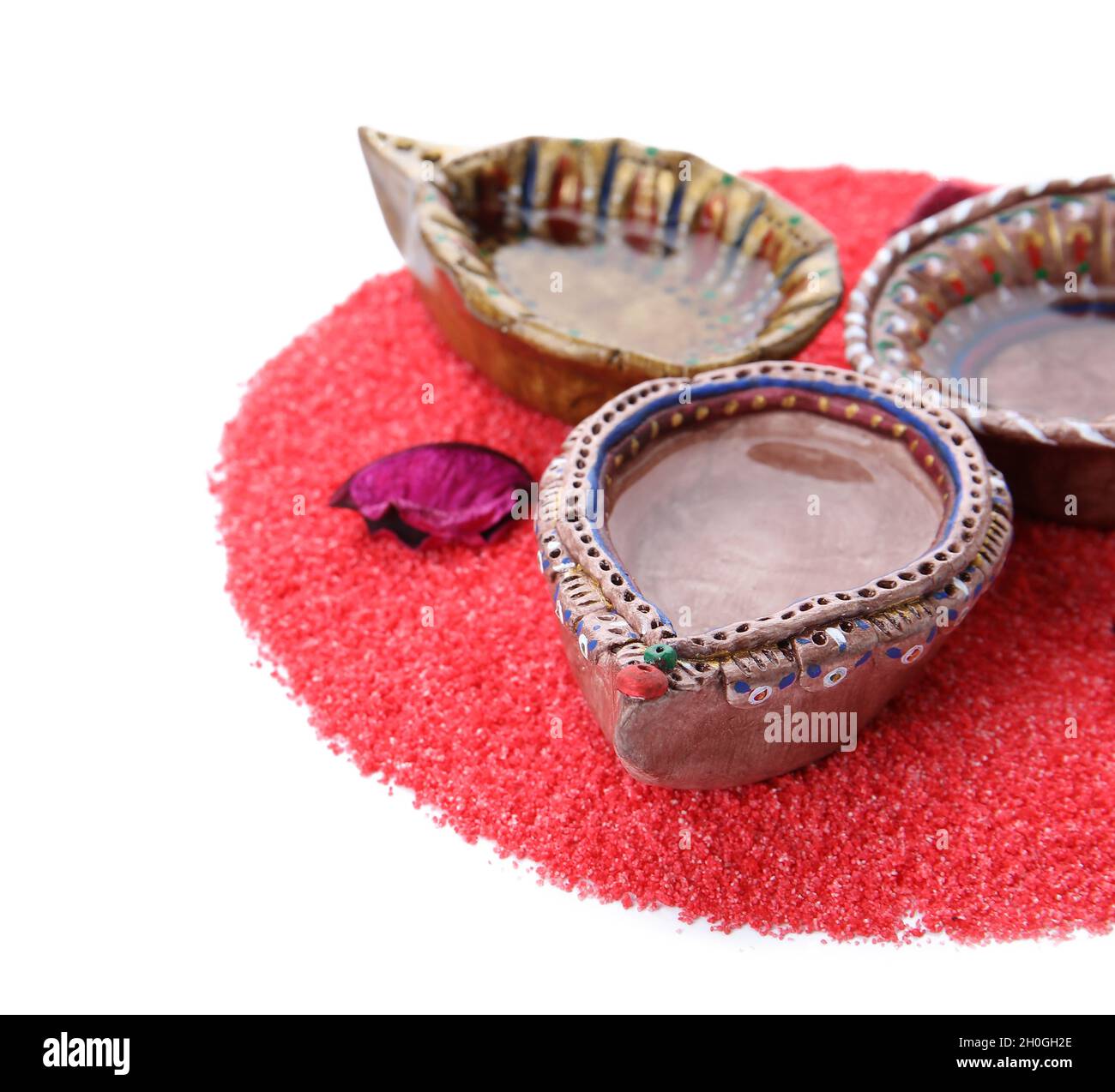 Diya lamps for Diwali with color powder on white background Stock Photo ...