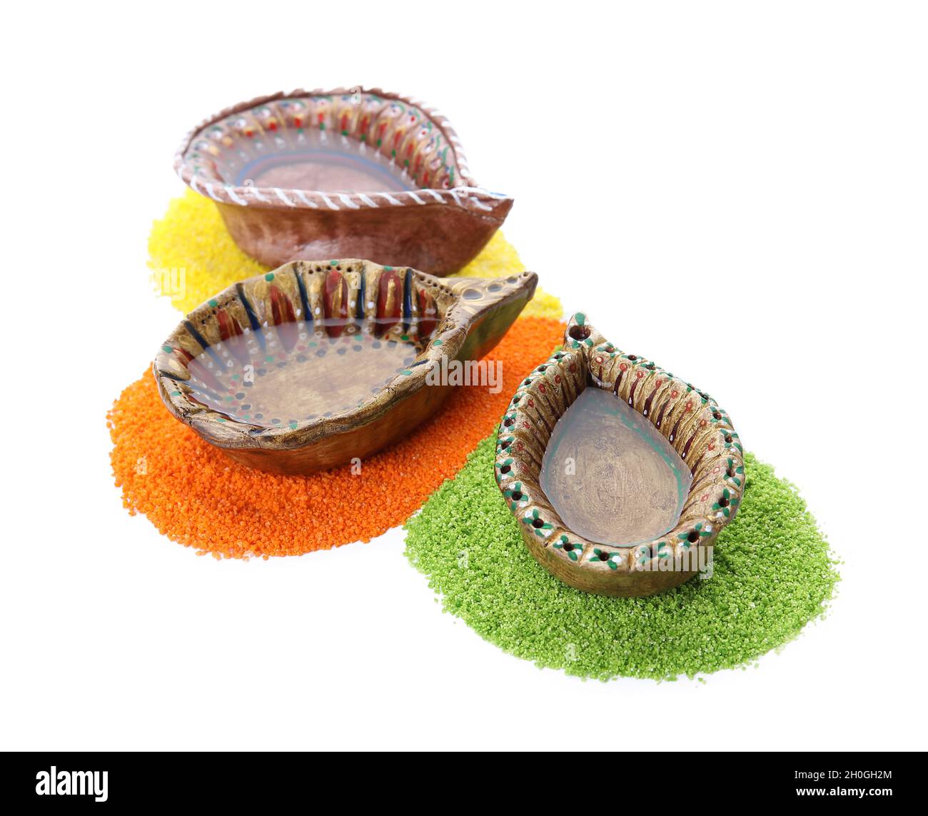 Diya lamps for Diwali with color powder on white background Stock Photo ...