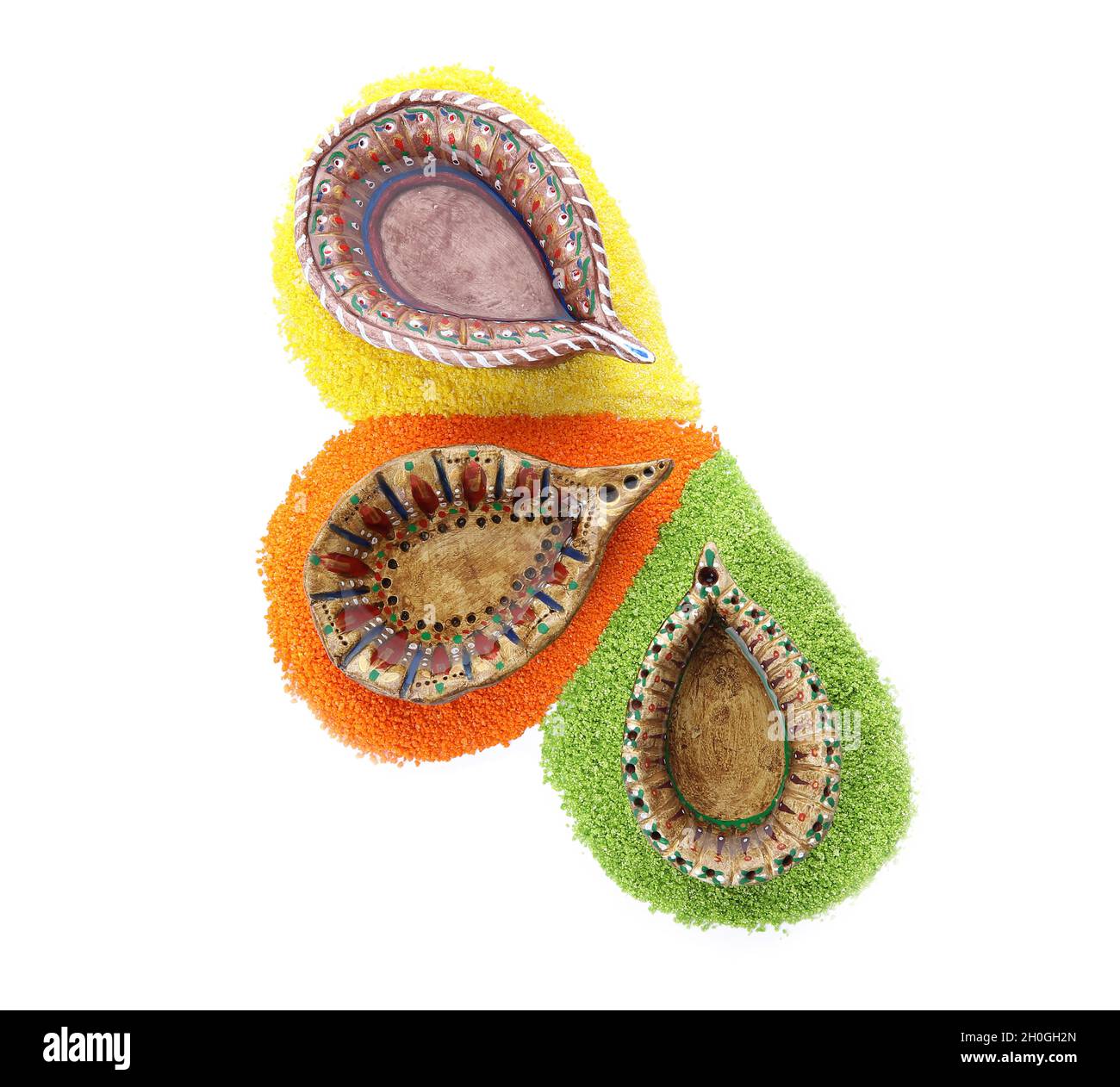 Diya lamps for Diwali with color powder on white background Stock Photo ...