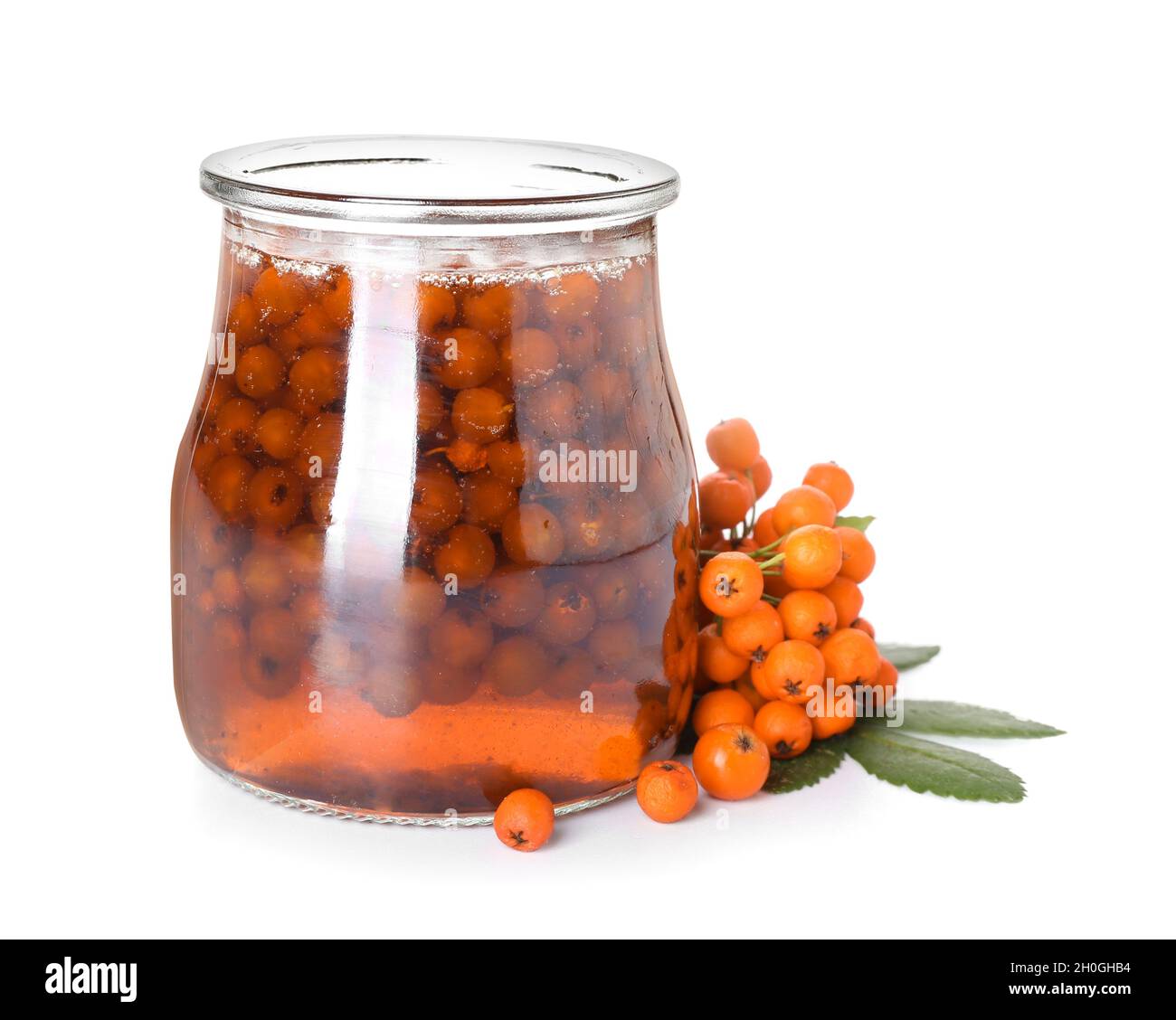 Jar of delicious rowan jam on white background Stock Photo - Alamy